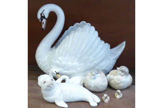 A large Dartmouth pottery swan, two Beswick swans and two cygnets, two ...