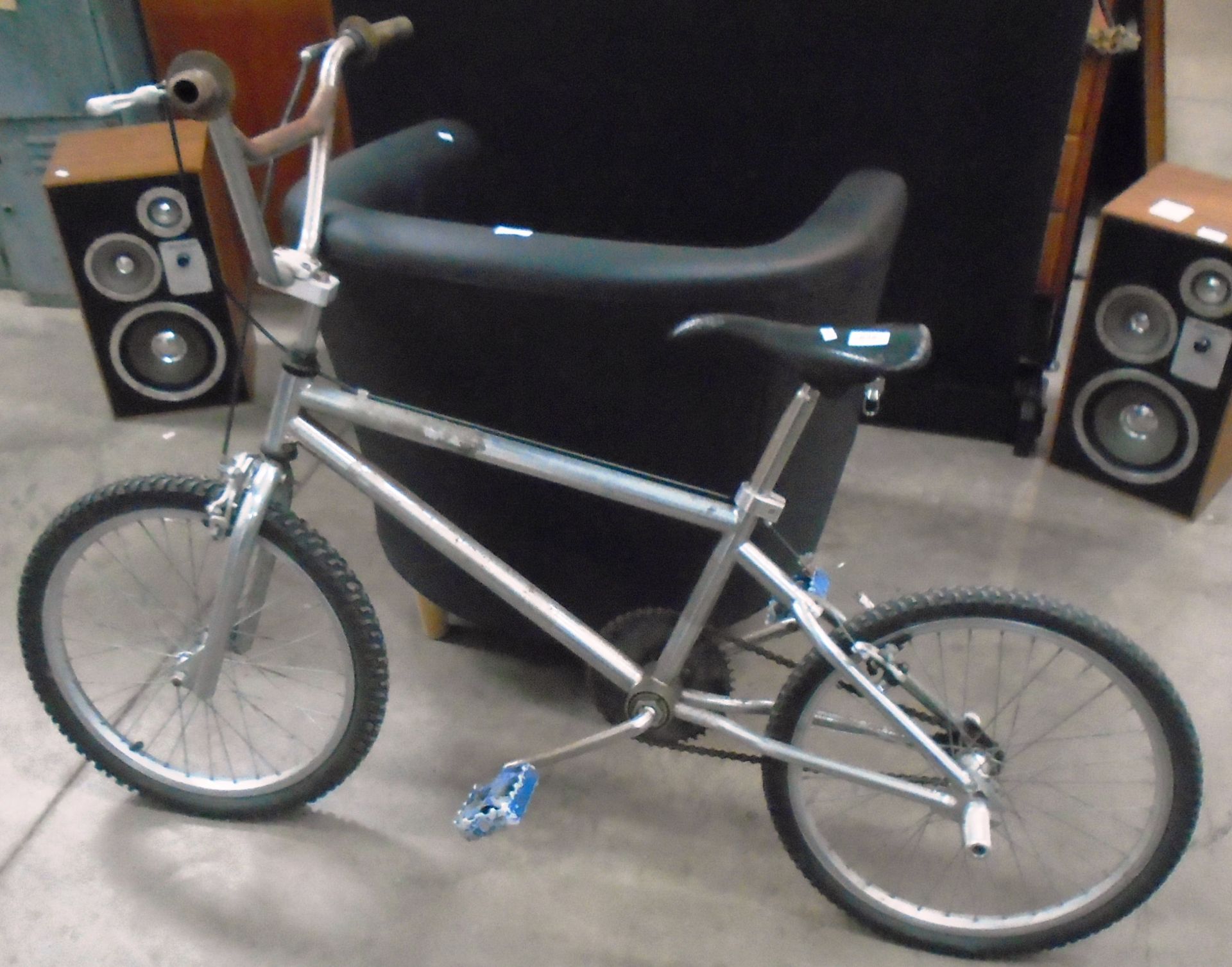 A Raleigh single speed silver BMX bike