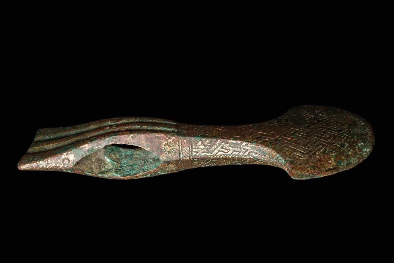 A BRONZE DECORATED AXE, KOBAN CULTURE, 8TH - 7TH CENTURY B.C. Origin ...