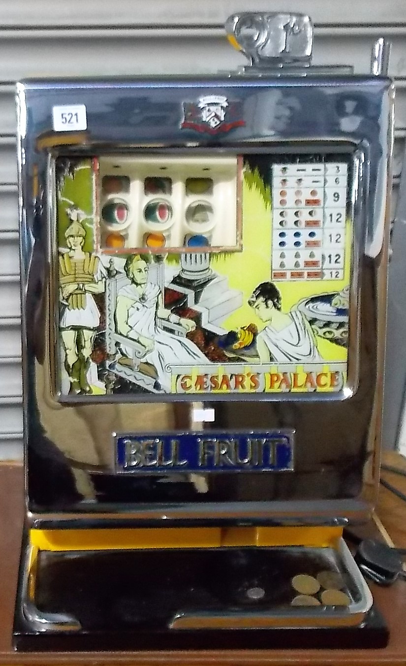 A vintage 'bell-fruit' fruit machine, height 61cm