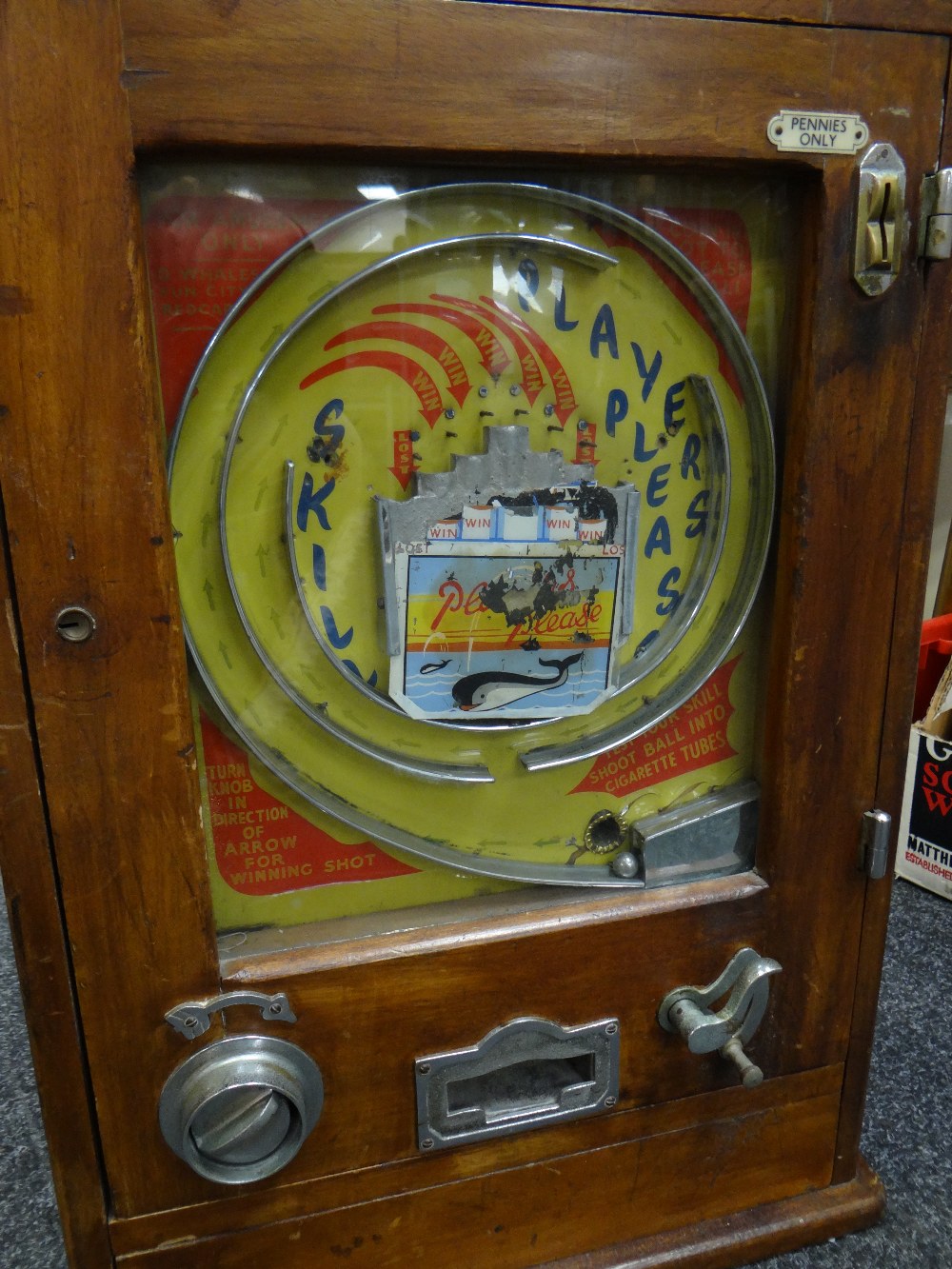 A vintage All Win Penny Play fairground machine