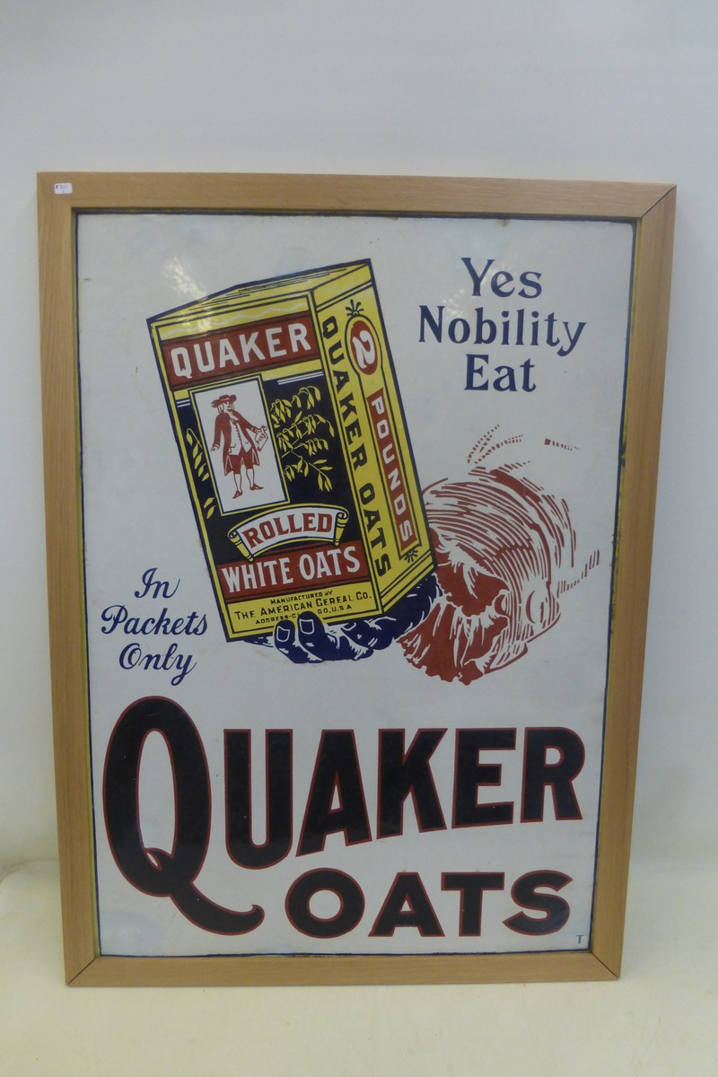 A Quaker Oats pictorial packet enamel sign, within a wooden frame, with ...
