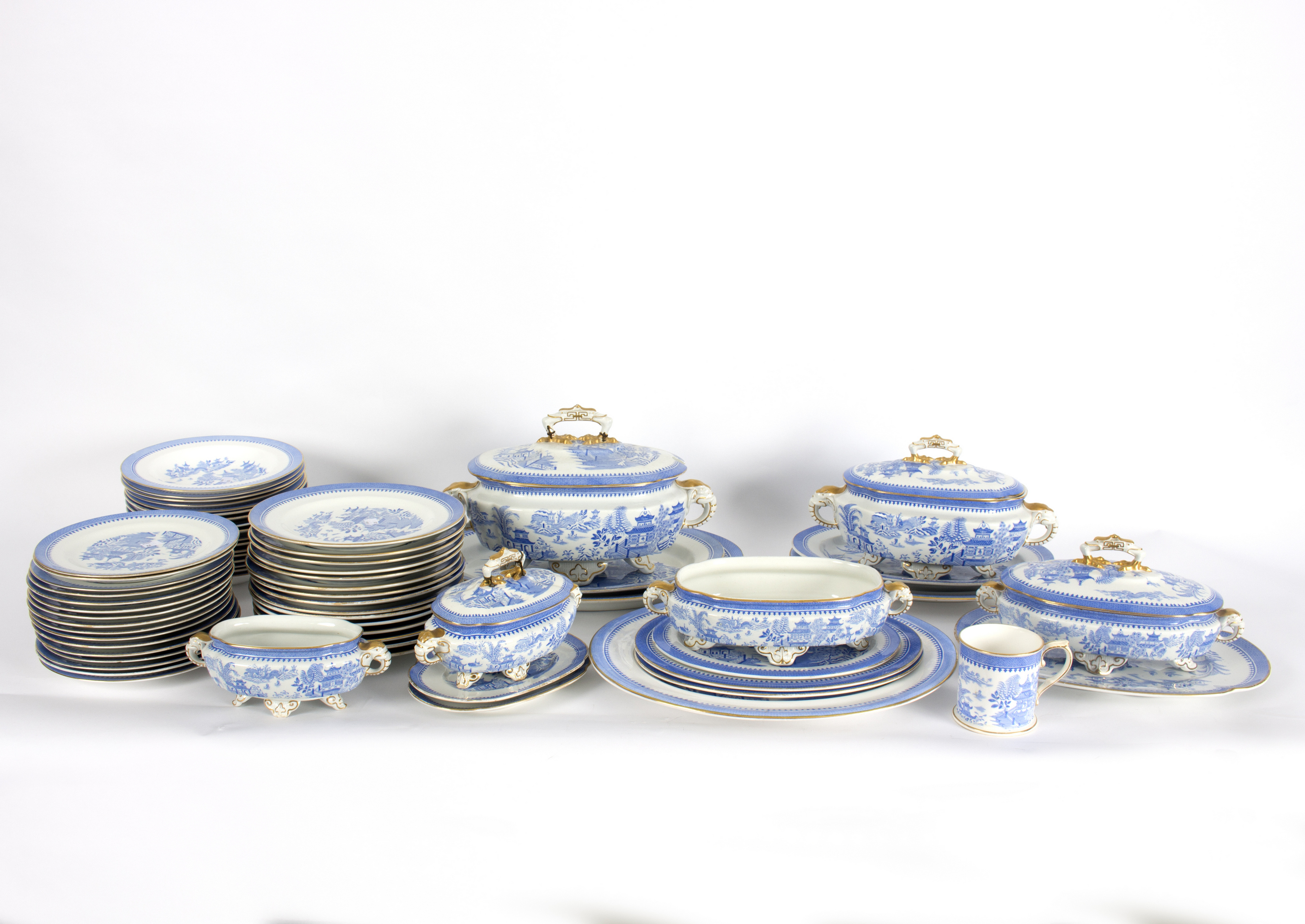 A Royal Worcester blue and white willow pattern dinner service, sixty ...