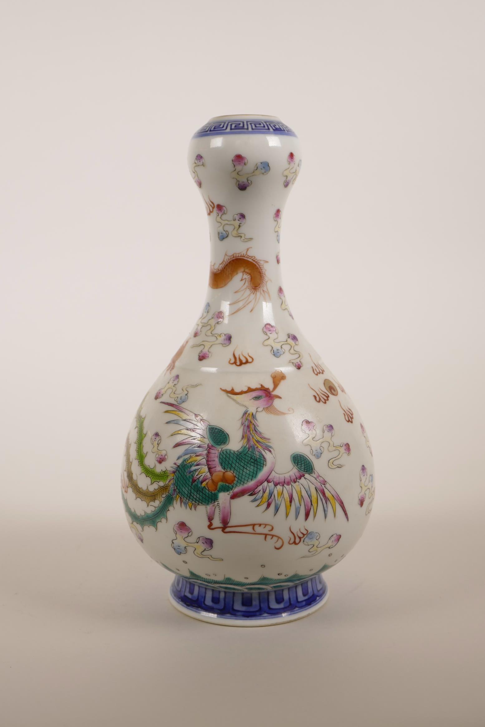 A Chinese polychrome porcelain garlic head shaped vase decorated with a ...
