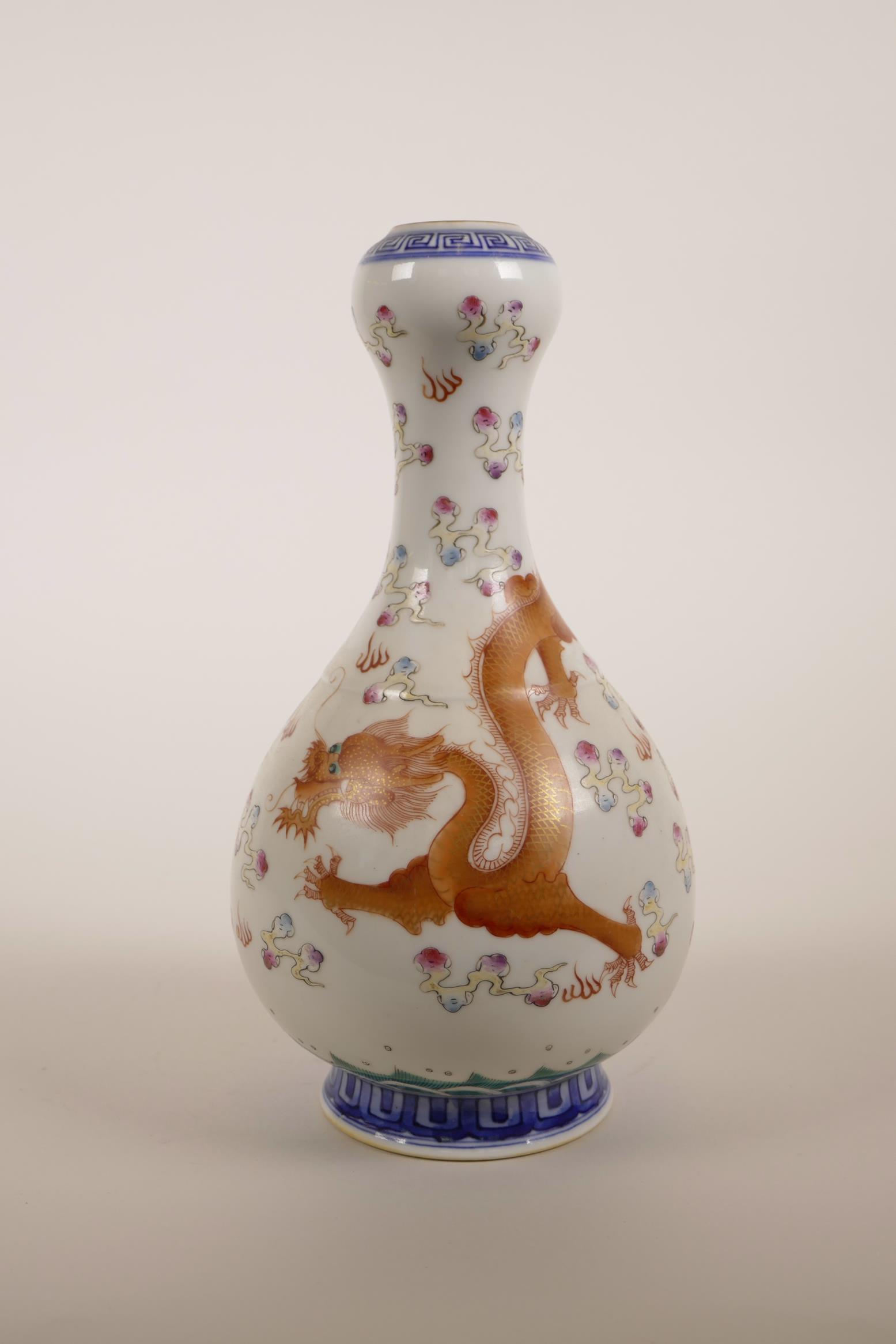 A Chinese polychrome porcelain garlic head shaped vase decorated with a ...