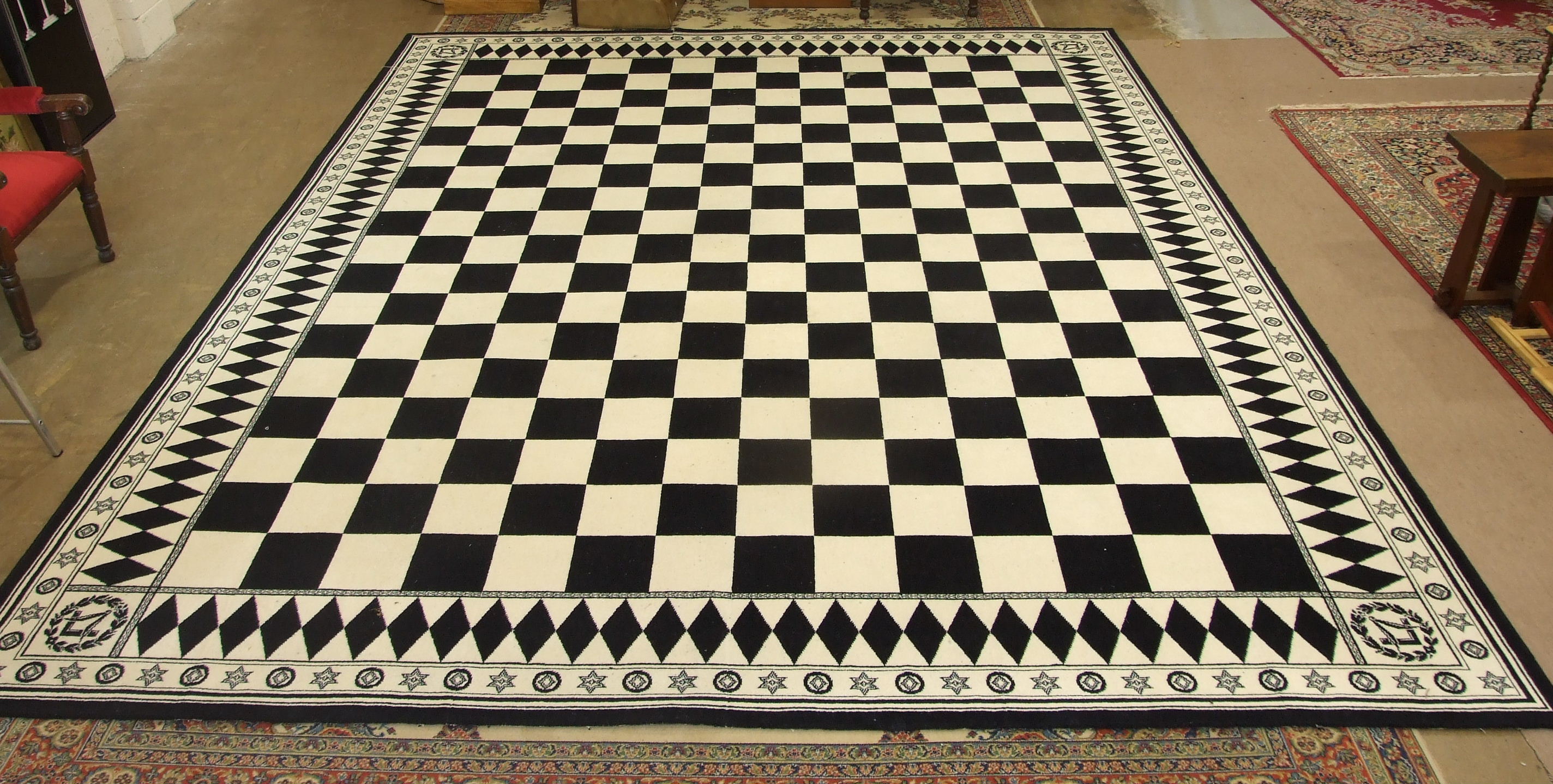 A large Masonic black and white carpet, the tessellated pavement within ...