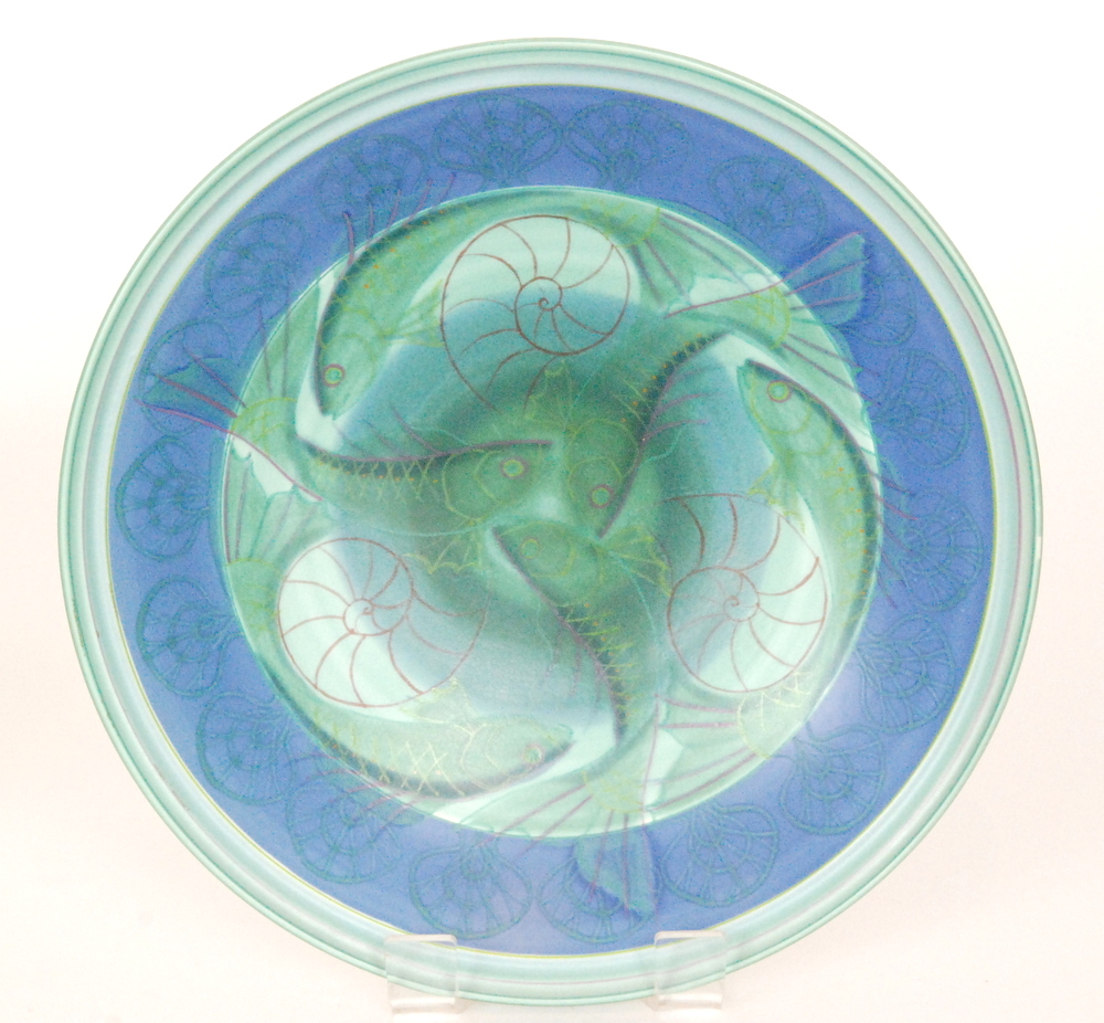 A large Poole Pottery Studio shallow footed bowl decorated with ...