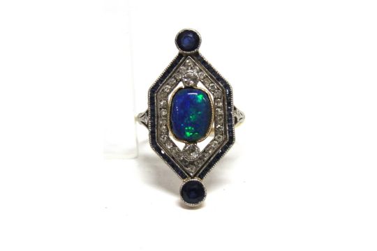 AN OPAL TRIPLET DIAMOND AND SAPPHIRE PANEL RING the oval cabochon with ...