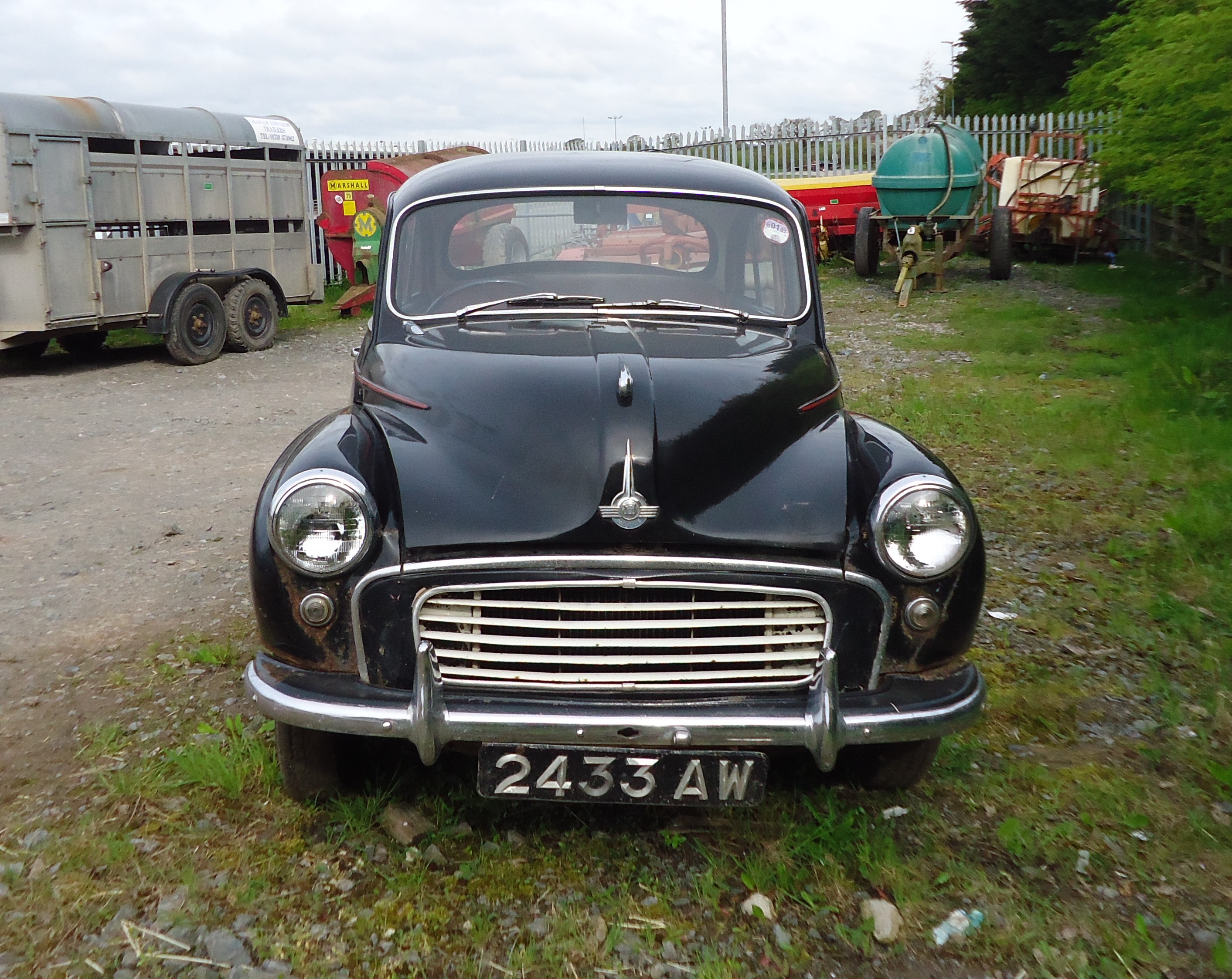 A 1963 black Morris Minor 948CC four door car, Registration No 2433 AW