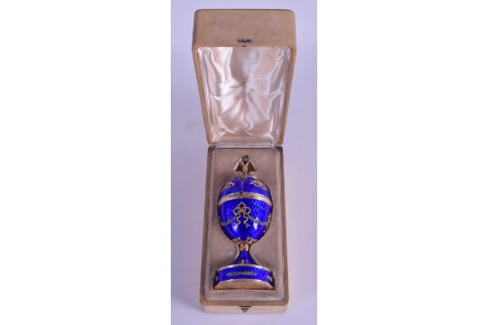 A FINE RUSSIAN SILVER GILT AND BLUE ENAMEL MANTEL CLOCK the egg shaped ...