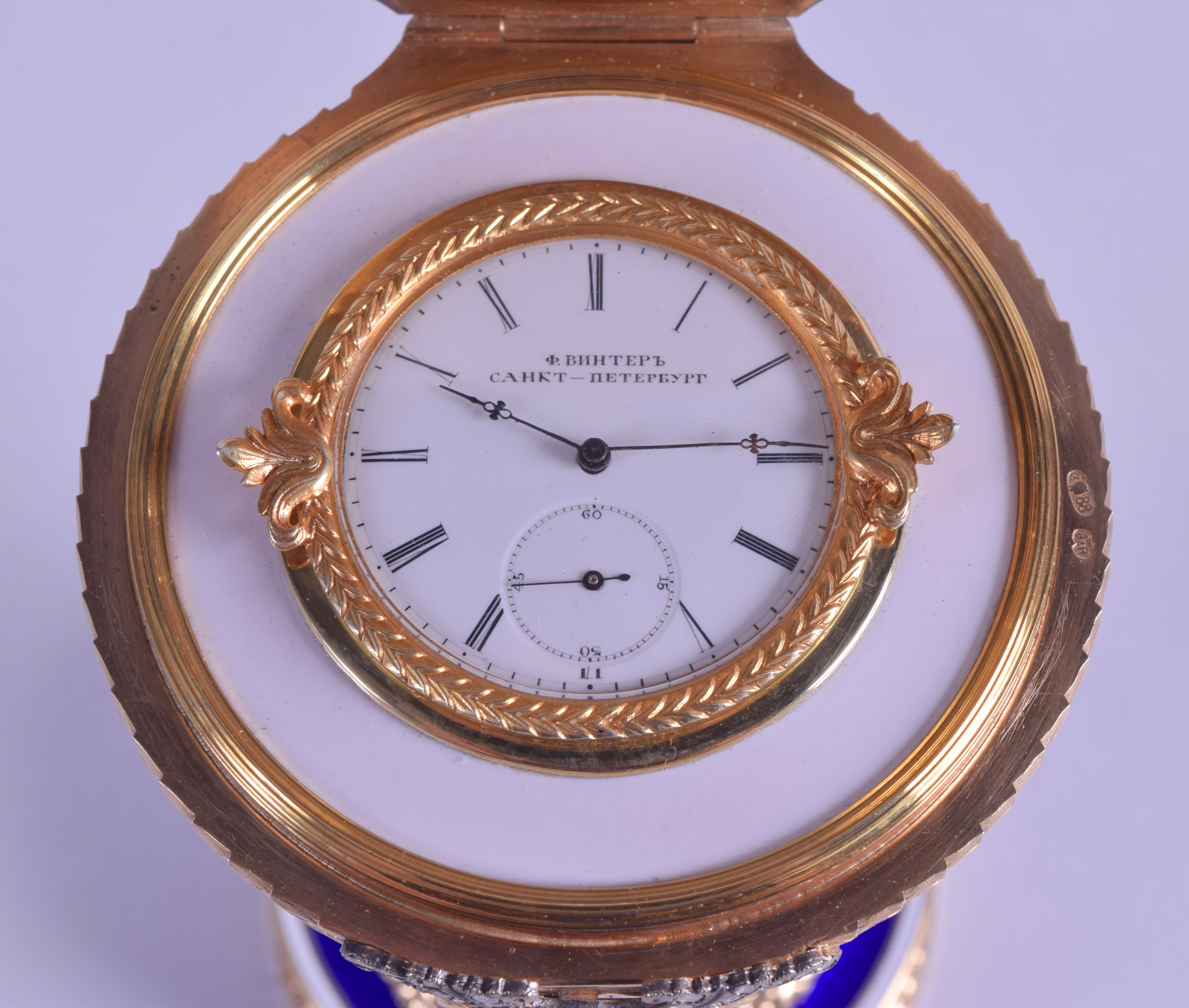 A FINE RUSSIAN SILVER GILT AND BLUE ENAMEL MANTEL CLOCK the egg shaped ...