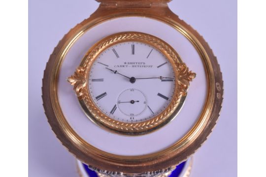 A FINE RUSSIAN SILVER GILT AND BLUE ENAMEL MANTEL CLOCK the egg shaped ...