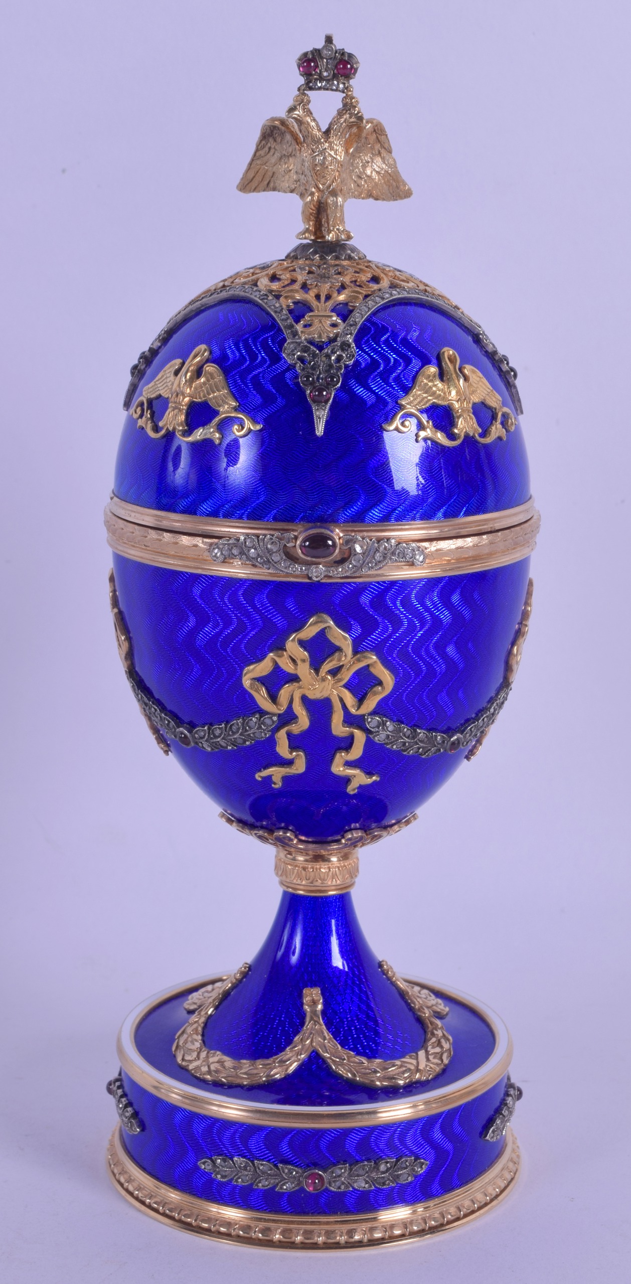 A FINE RUSSIAN SILVER GILT AND BLUE ENAMEL MANTEL CLOCK the egg shaped ...