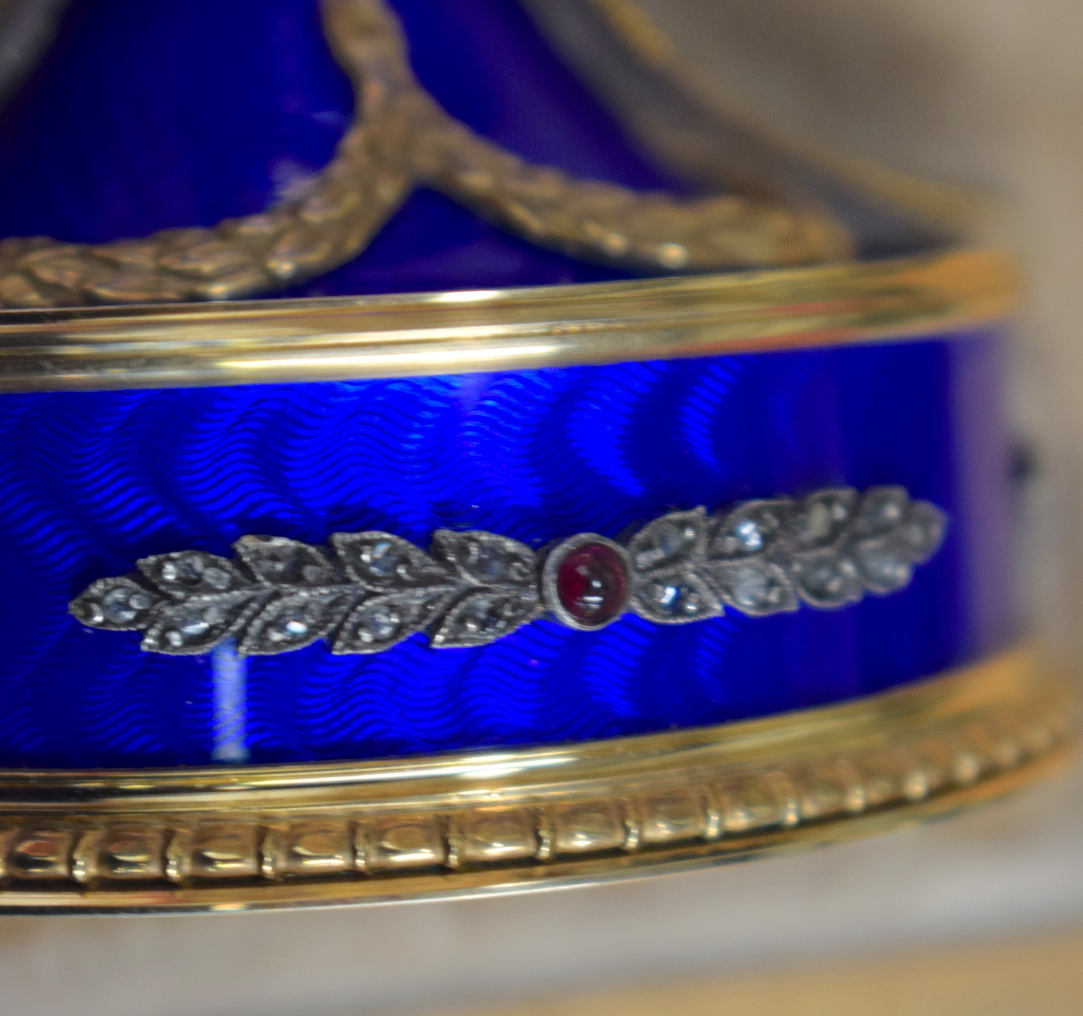 A FINE RUSSIAN SILVER GILT AND BLUE ENAMEL MANTEL CLOCK the egg shaped ...