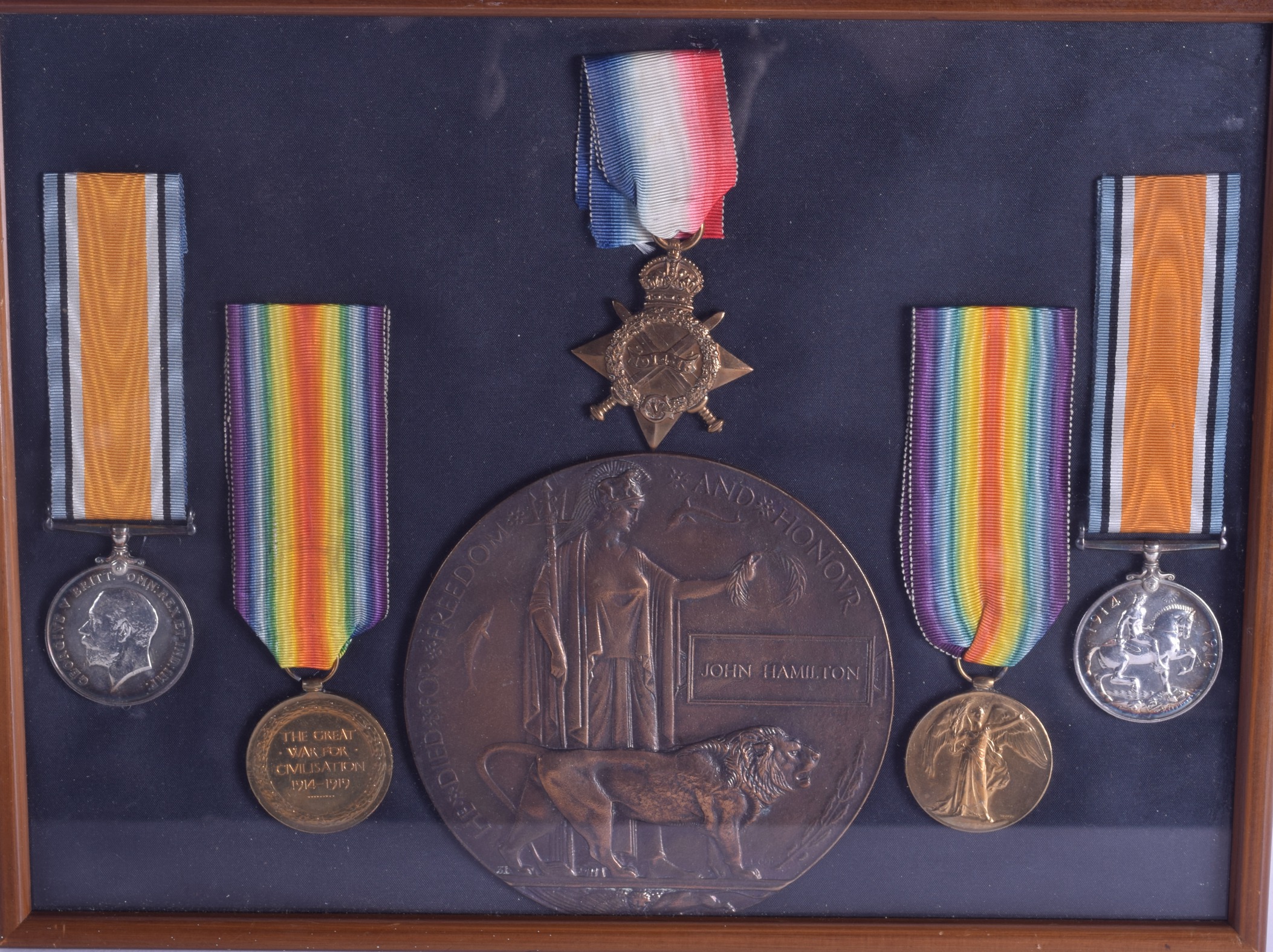 A FRAMED SET OF WW1 MEDALS presented to Pte John Hamilton A & S Highrs ...