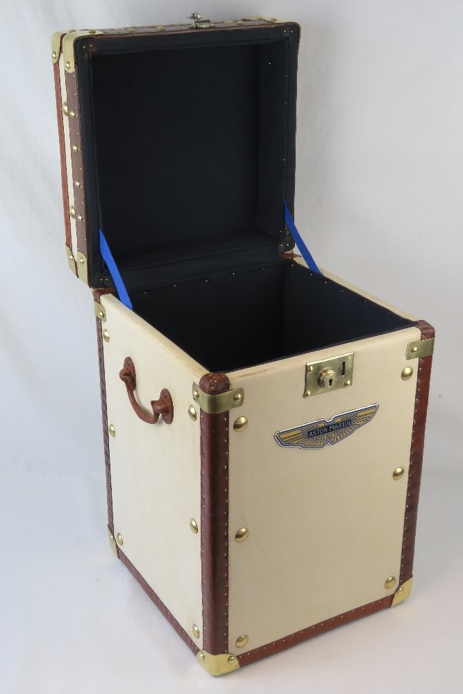 A single Army and Navy type cream leather lidded trunk with brown ...