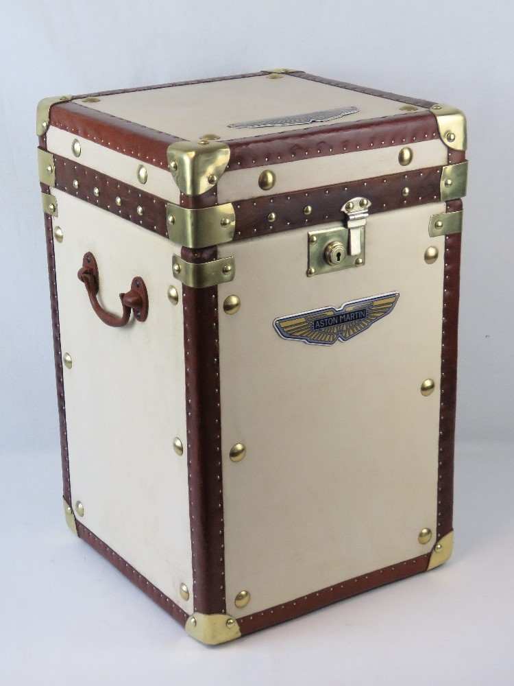 A single Army and Navy type cream leather lidded trunk with brown ...