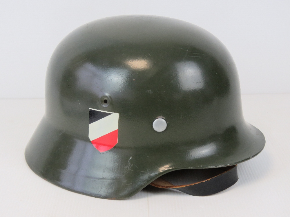 A reproduction WWII German helmet - film prop.