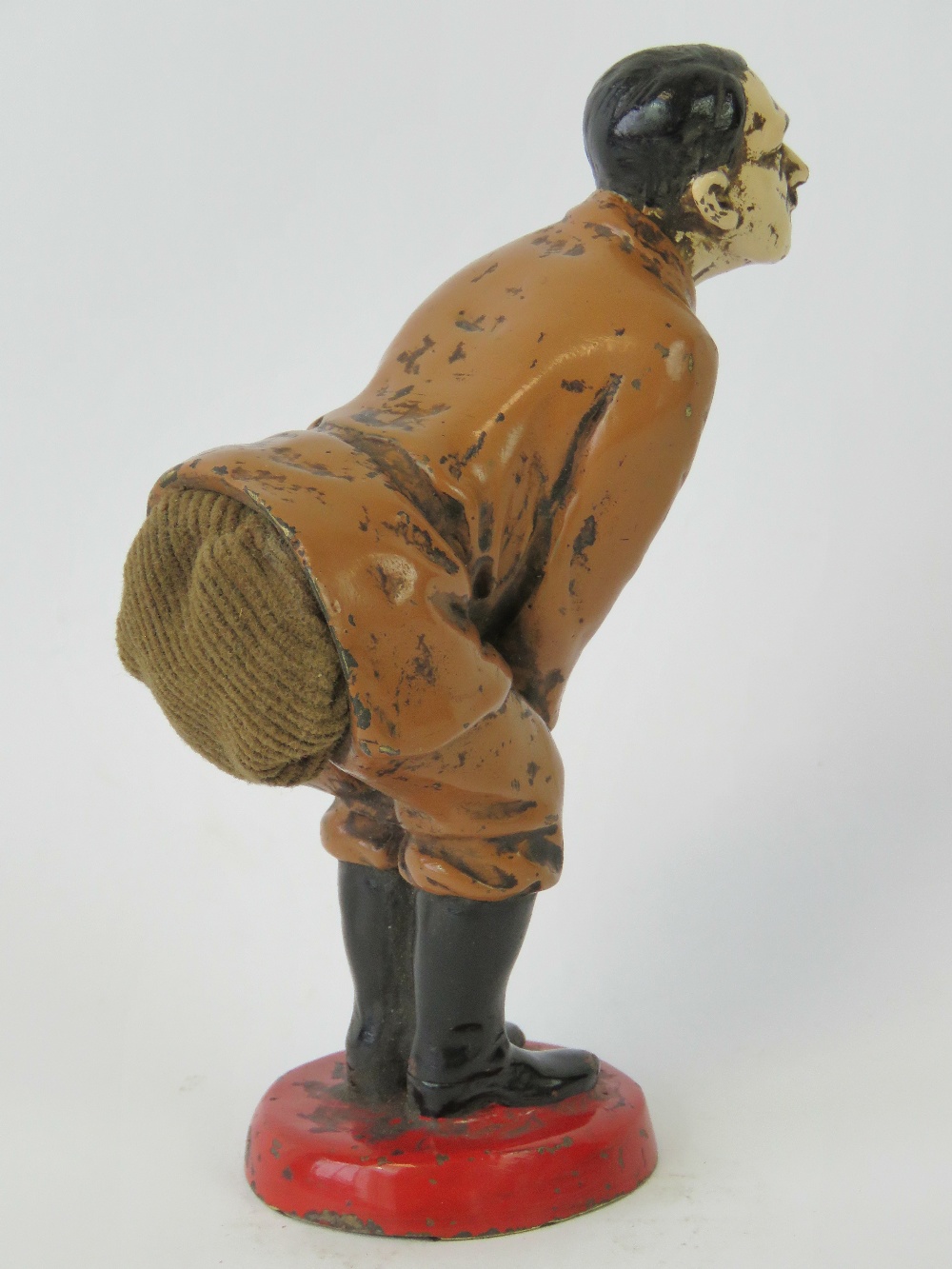 A novelty pin cushion in the form of Adolf Hitler, enamel on brass ...