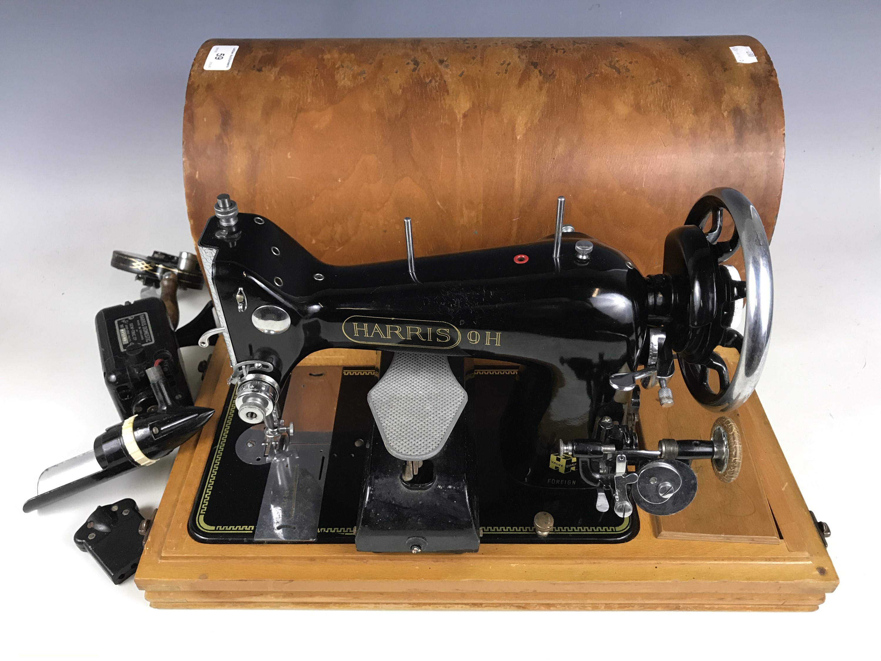 A Harris 9H sewing machine with accessories