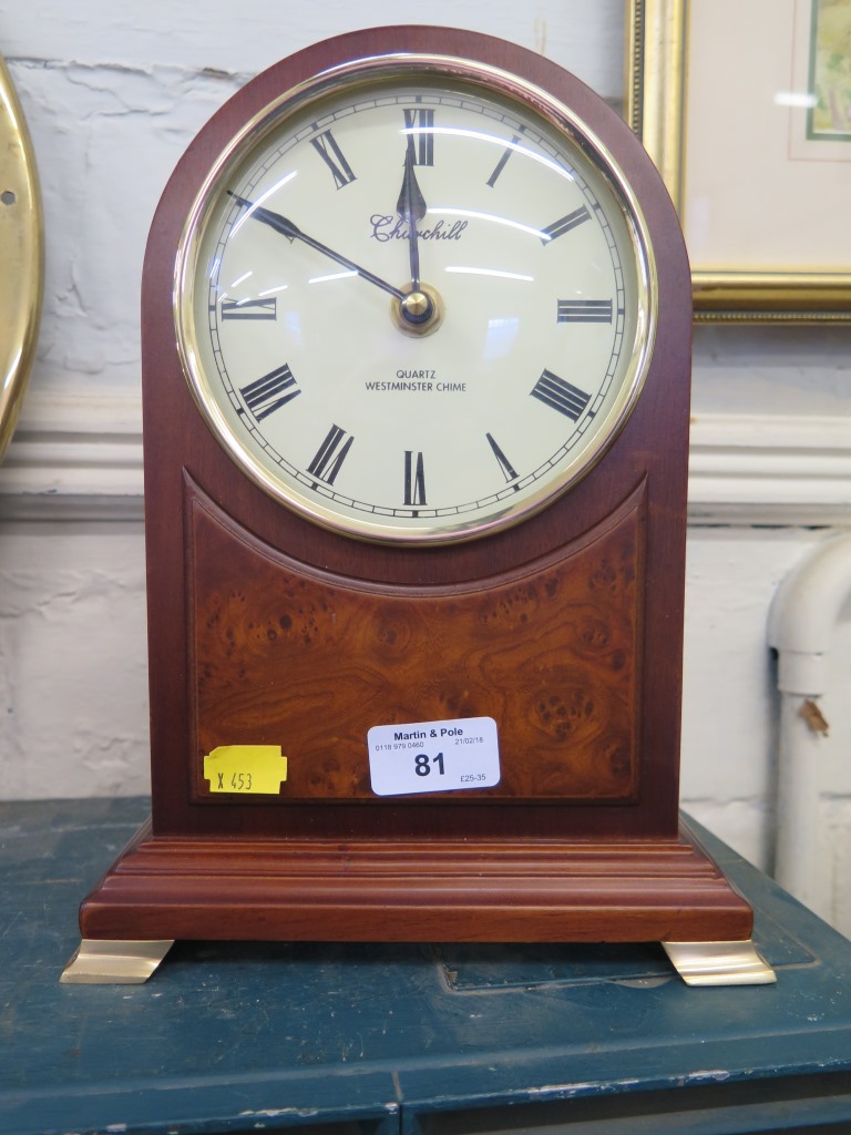 A Churchill Westminster chiming walnut cased quartz mantel clock, 27cm high