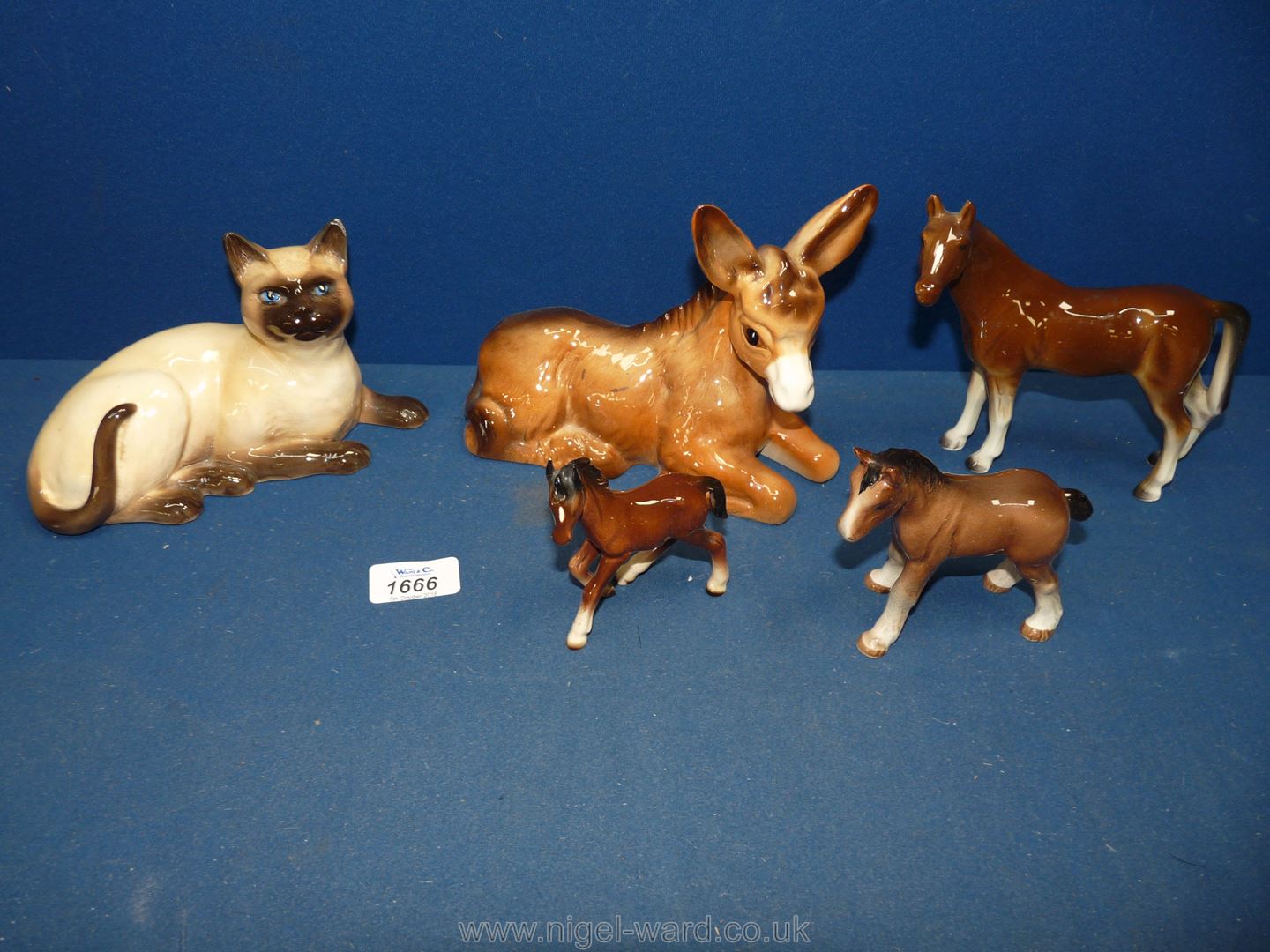 Four figures of horses, foals and donkeys including Sylvac foal a/f and ...