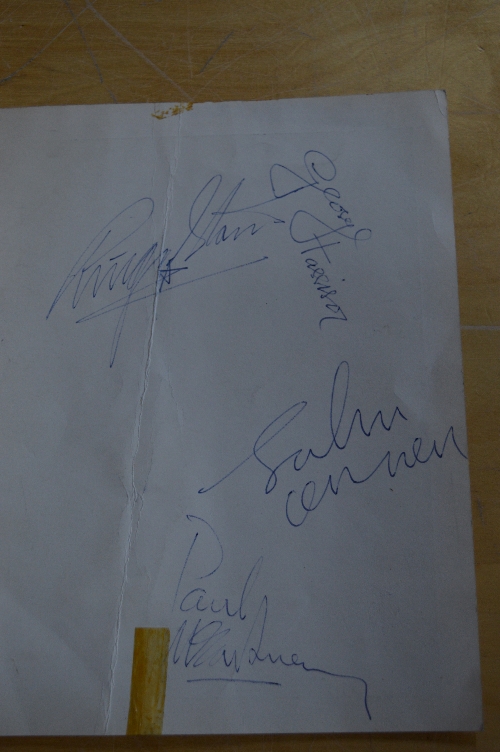 THE BEATLES AUTOGRAPHS, all four signatures in blue biro on the reverse ...