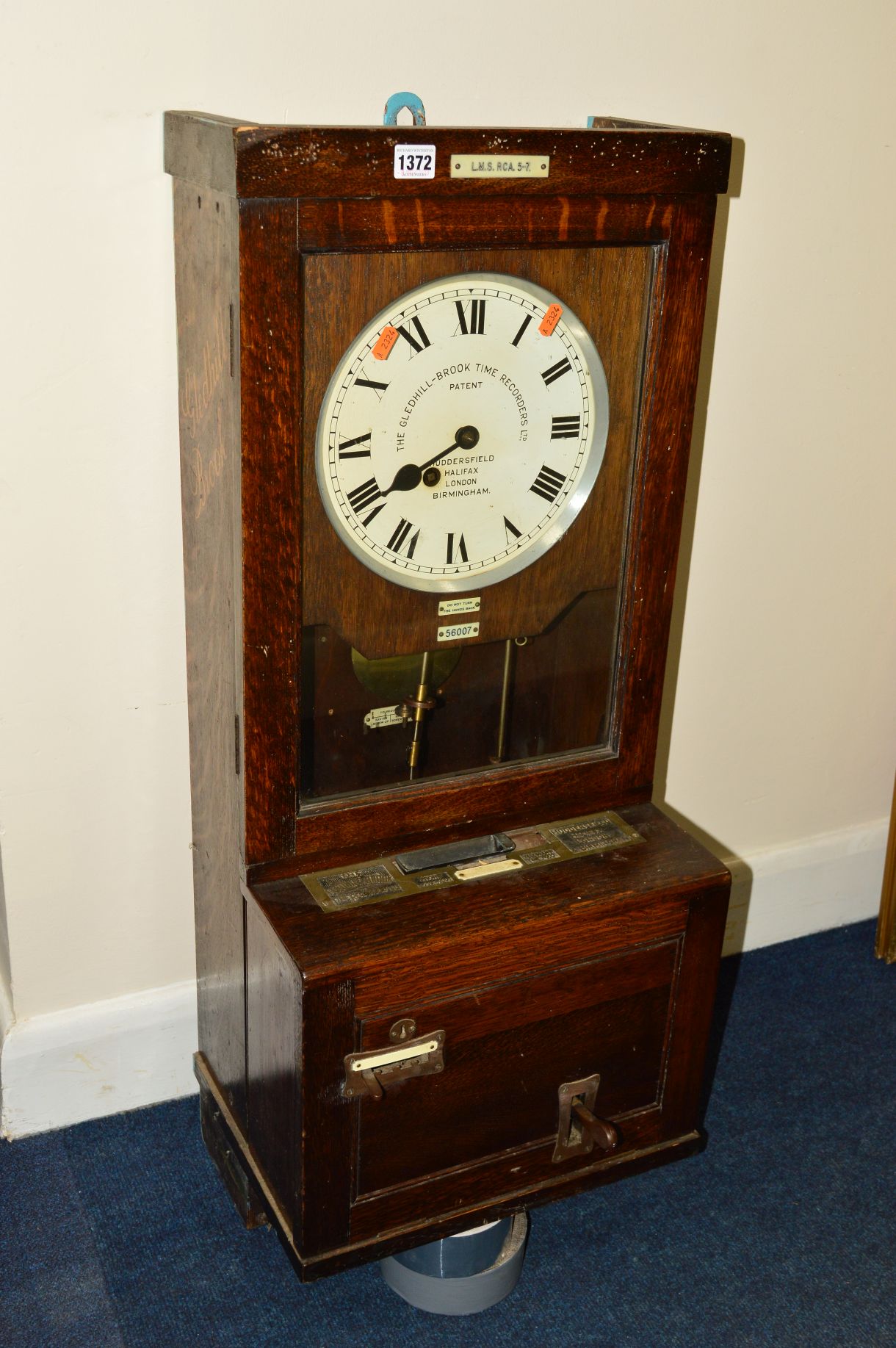 THE GLEDHILL-BROOK TIME RECORDER, an oak cased clocking in machine