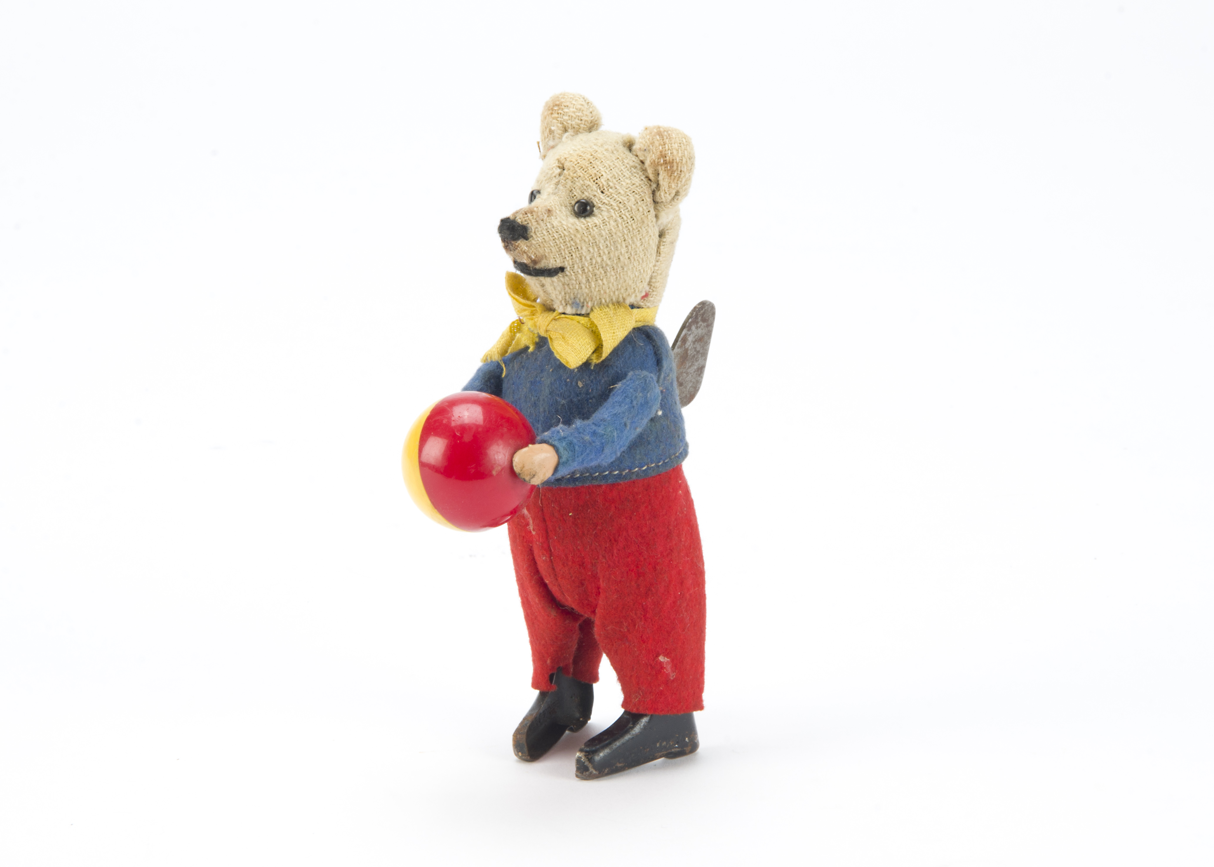 A rare Schuco clockwork teddy bear with ball, 1930s, with unusual cream ...