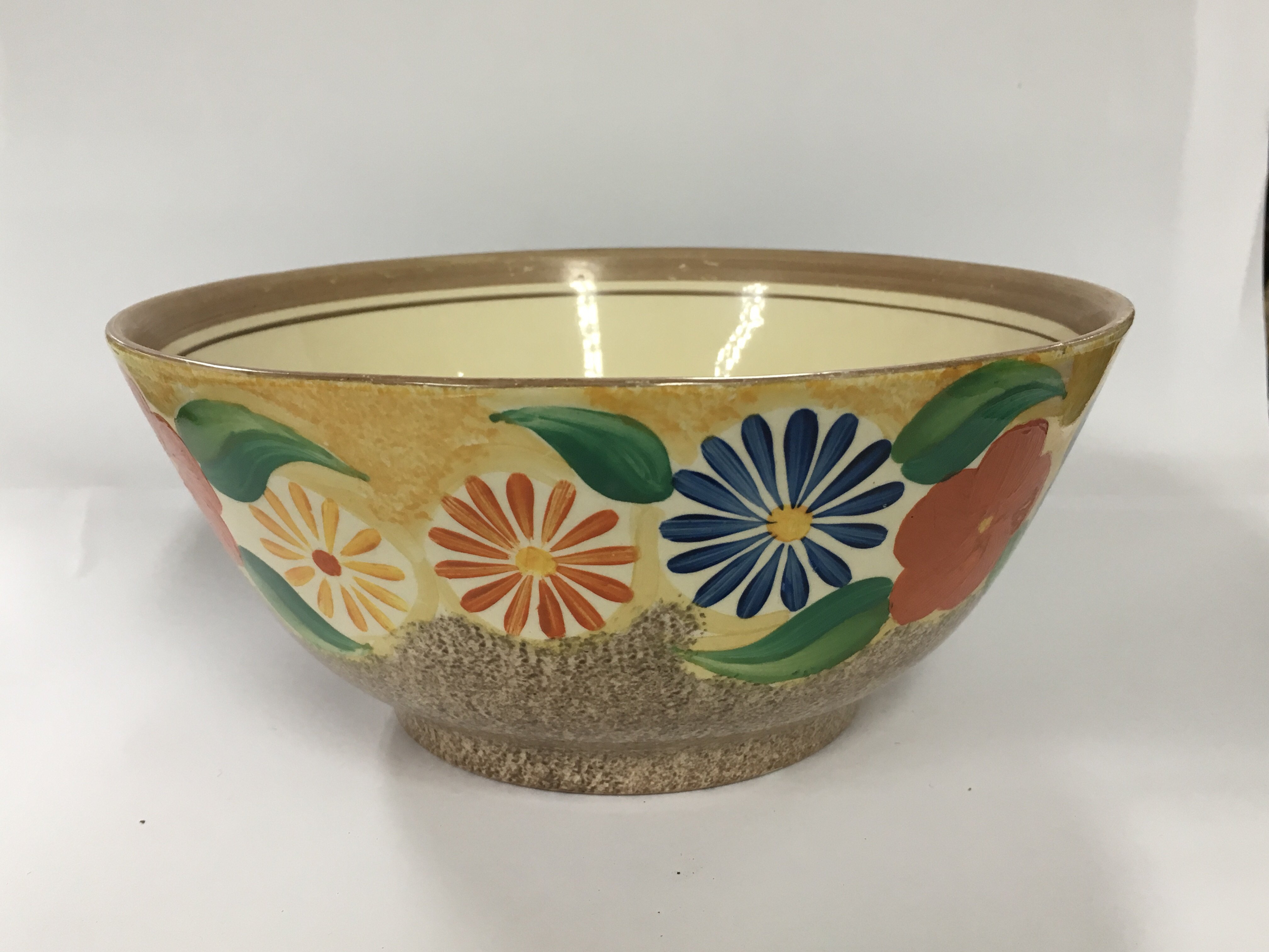 A Clarice Cliff floral pattern bowl 20cm diameter