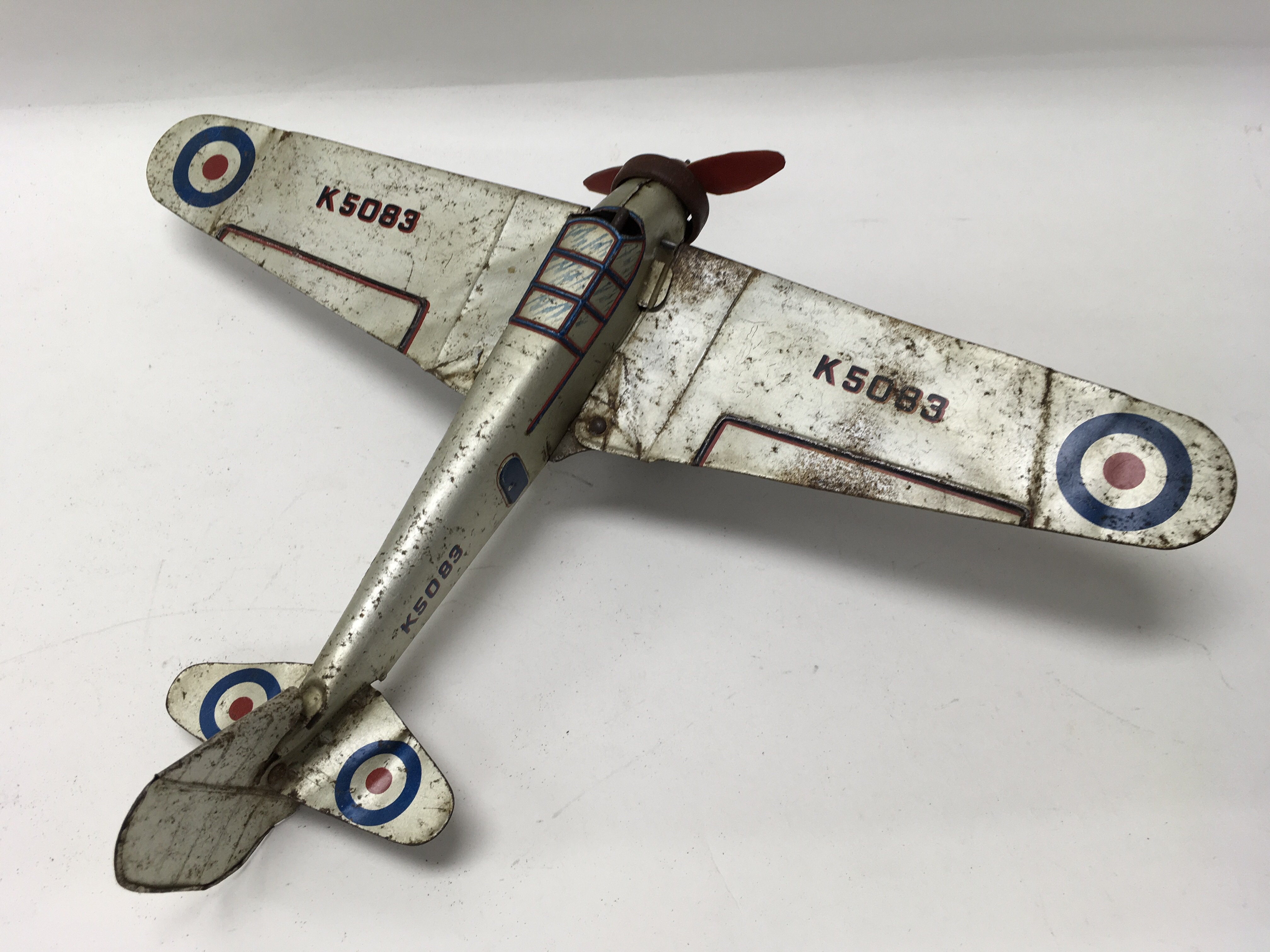 A tin plate clockwork plane.
