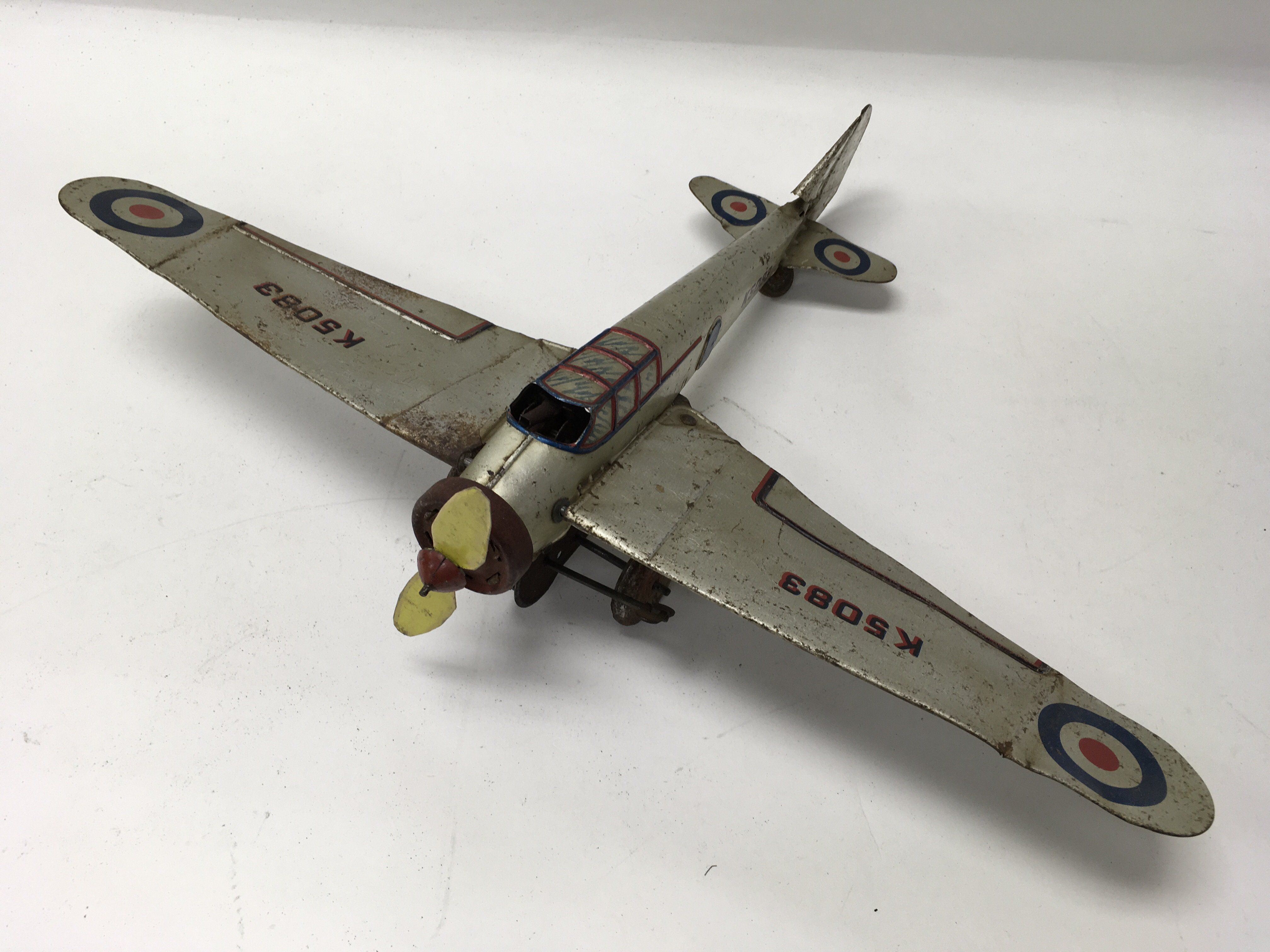 A tin plate clockwork plane.
