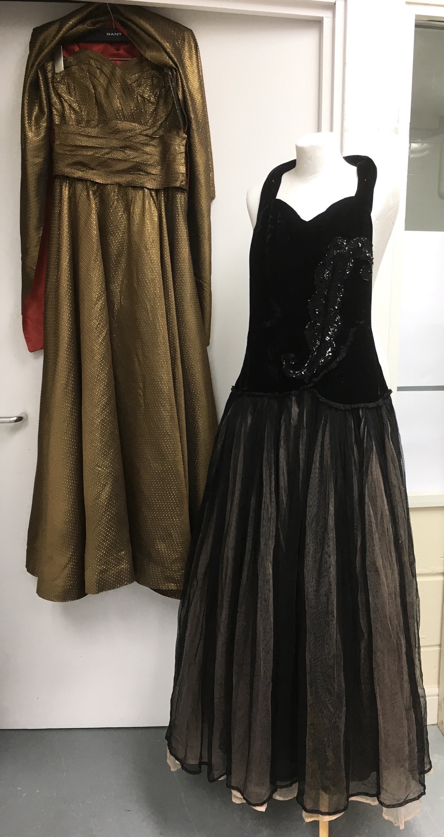 A 1950's tailor made black ballgown with halter neck velvet bodice and ...