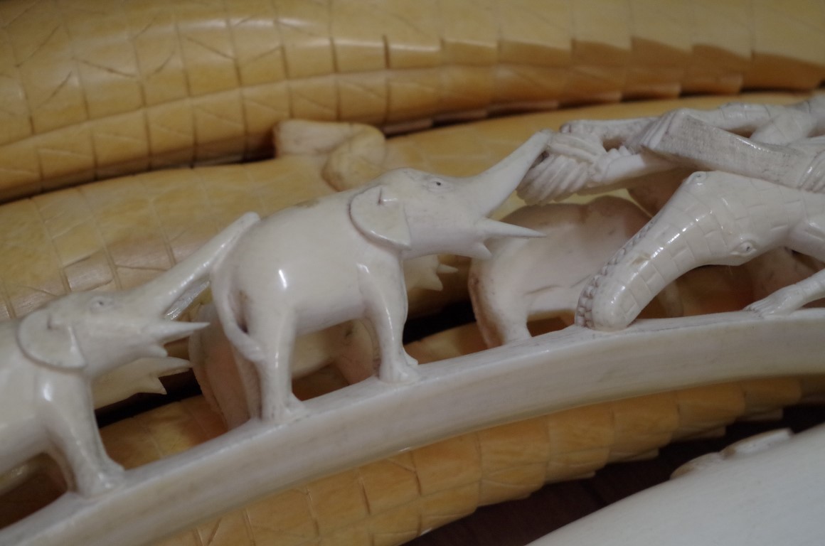 Five carved ivory items.