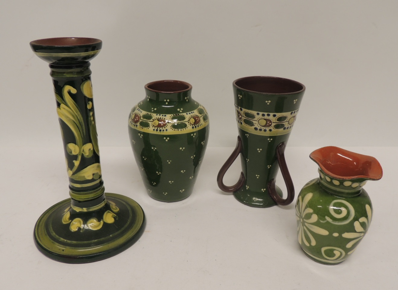 Aller Vale pottery candlestick, 21cms high, three handled vase and two ...