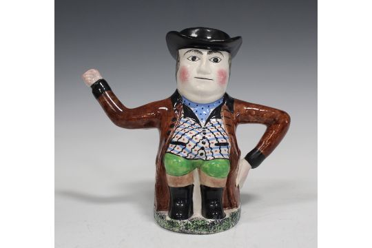 An unusual pottery Toby teapot with Portobello type sponged base and ...