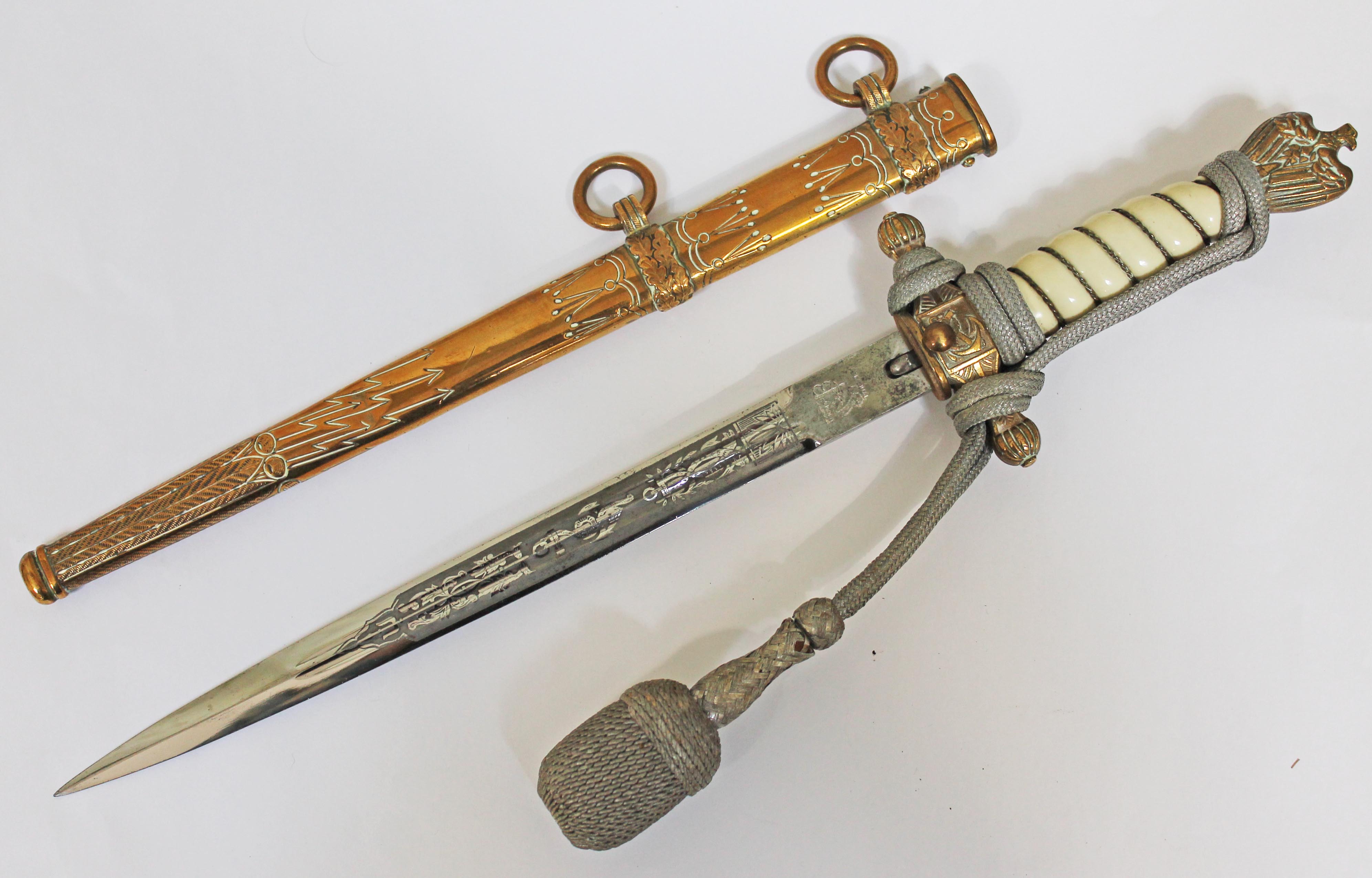 A Nazi Naval Officer's dress dagger with plastic wire bound grip, gilt ...