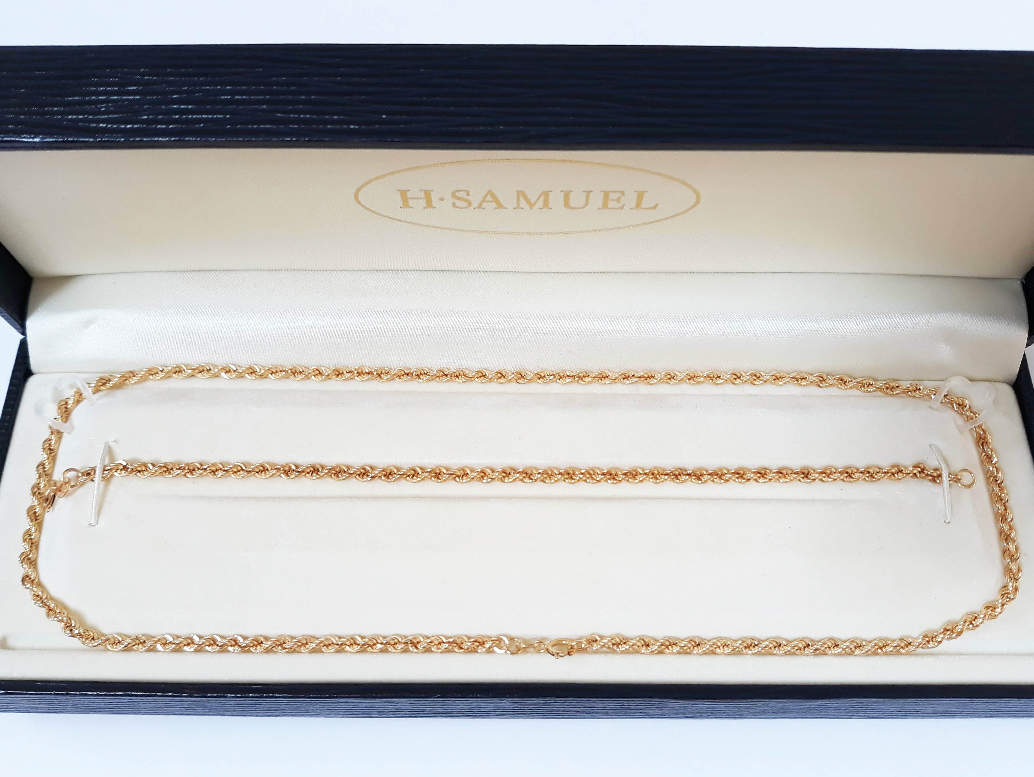 A 9ct gold necklace and matching bracelet marked 9kt and with UK import ...