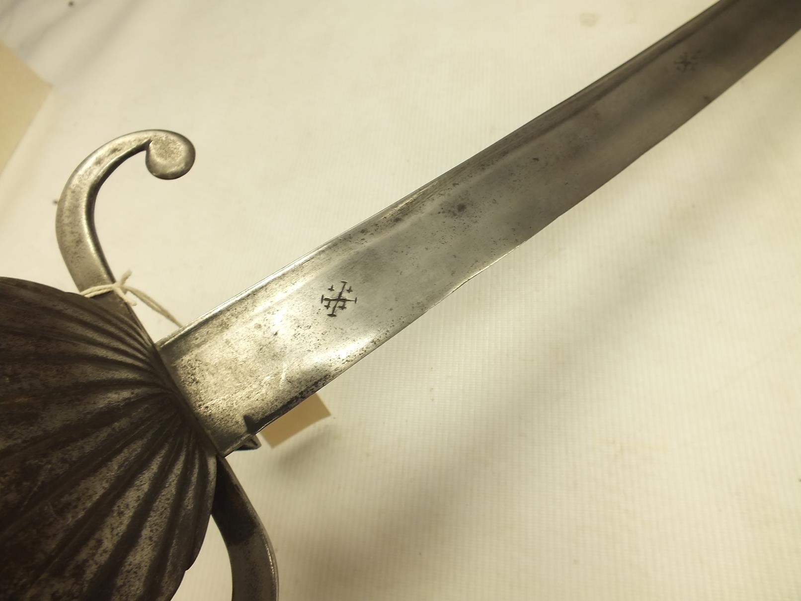 AN ITALIAN FALCHION, 86.5cm slightly curved fullered blade with clipped ...