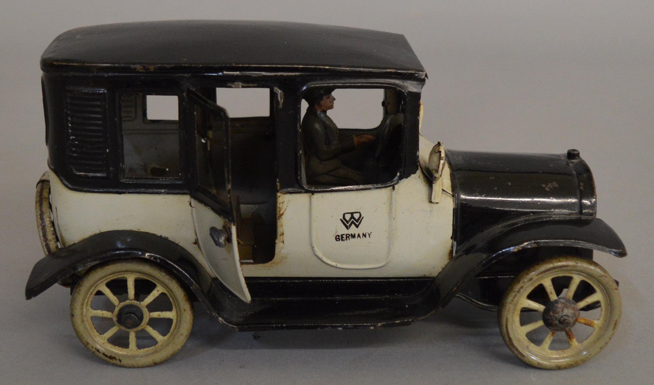 A scarce Bing German tinplate car model with two-tone black and grey ...