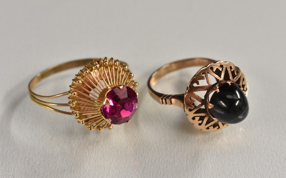 Rings - An Iranian gold coloured metal ring set with a vibrant pink ...