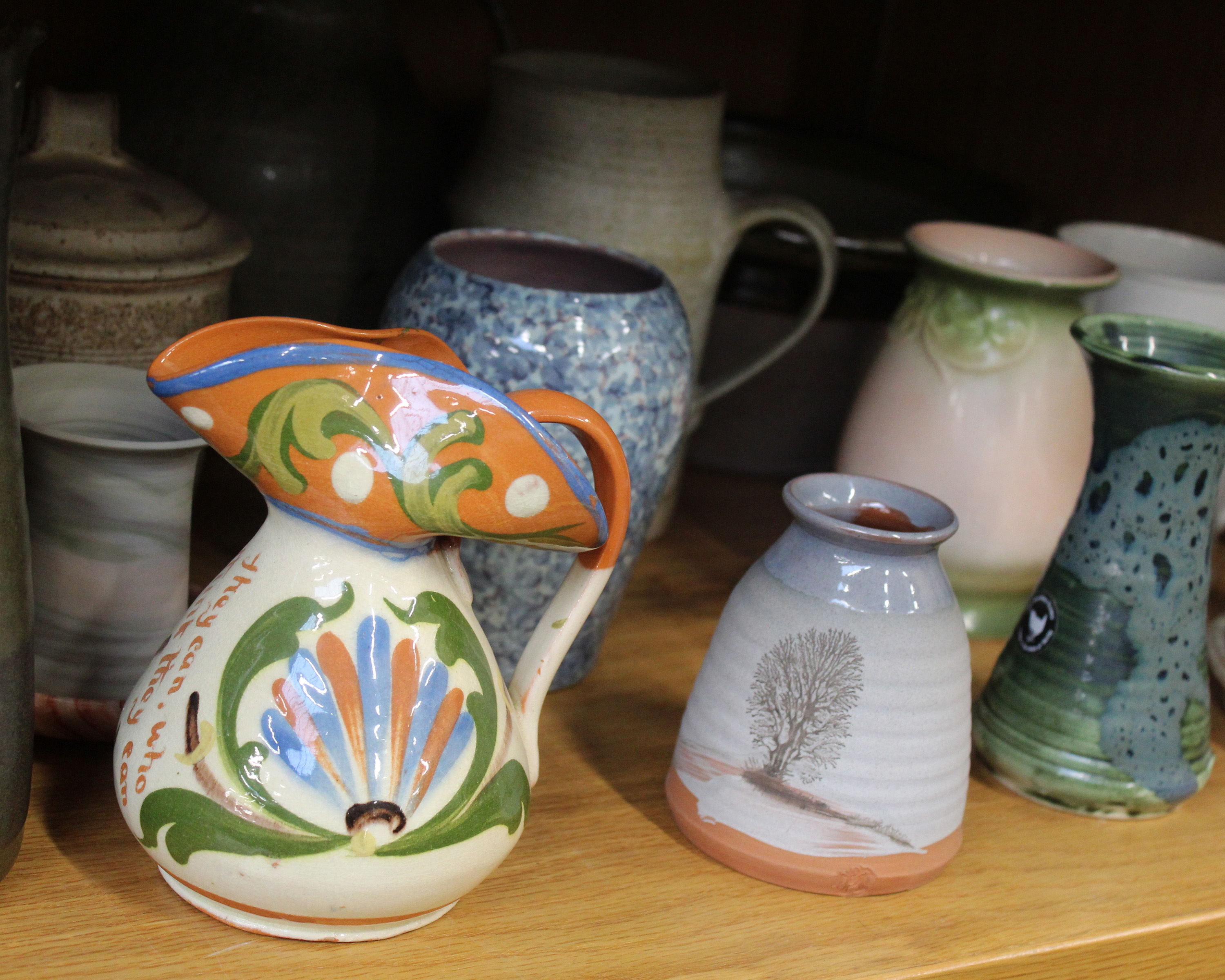 A collection of stoneware and studio pottery items