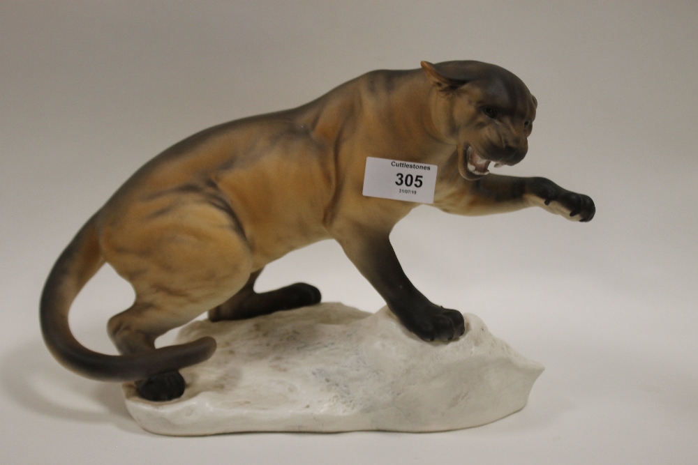 A BESWICK MATTE FINISH PUMA ON A ROCK FIGURE