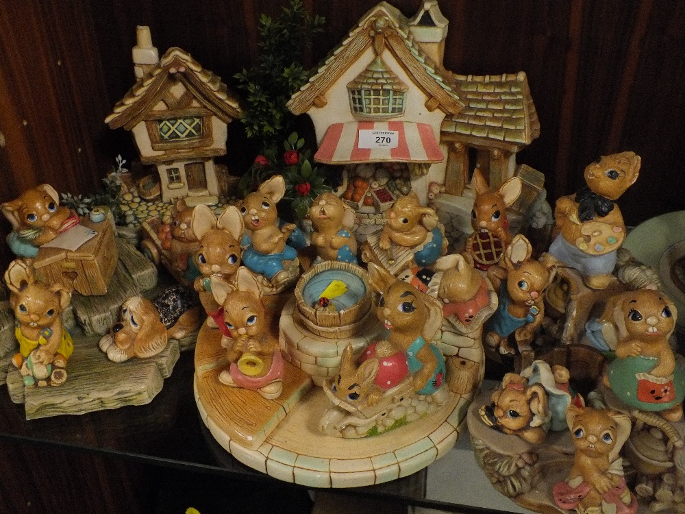 A COLLECTION OF PENDELFIN AND OTHER RABBIT FIGURES AND DISPLAY STANDS ETC.