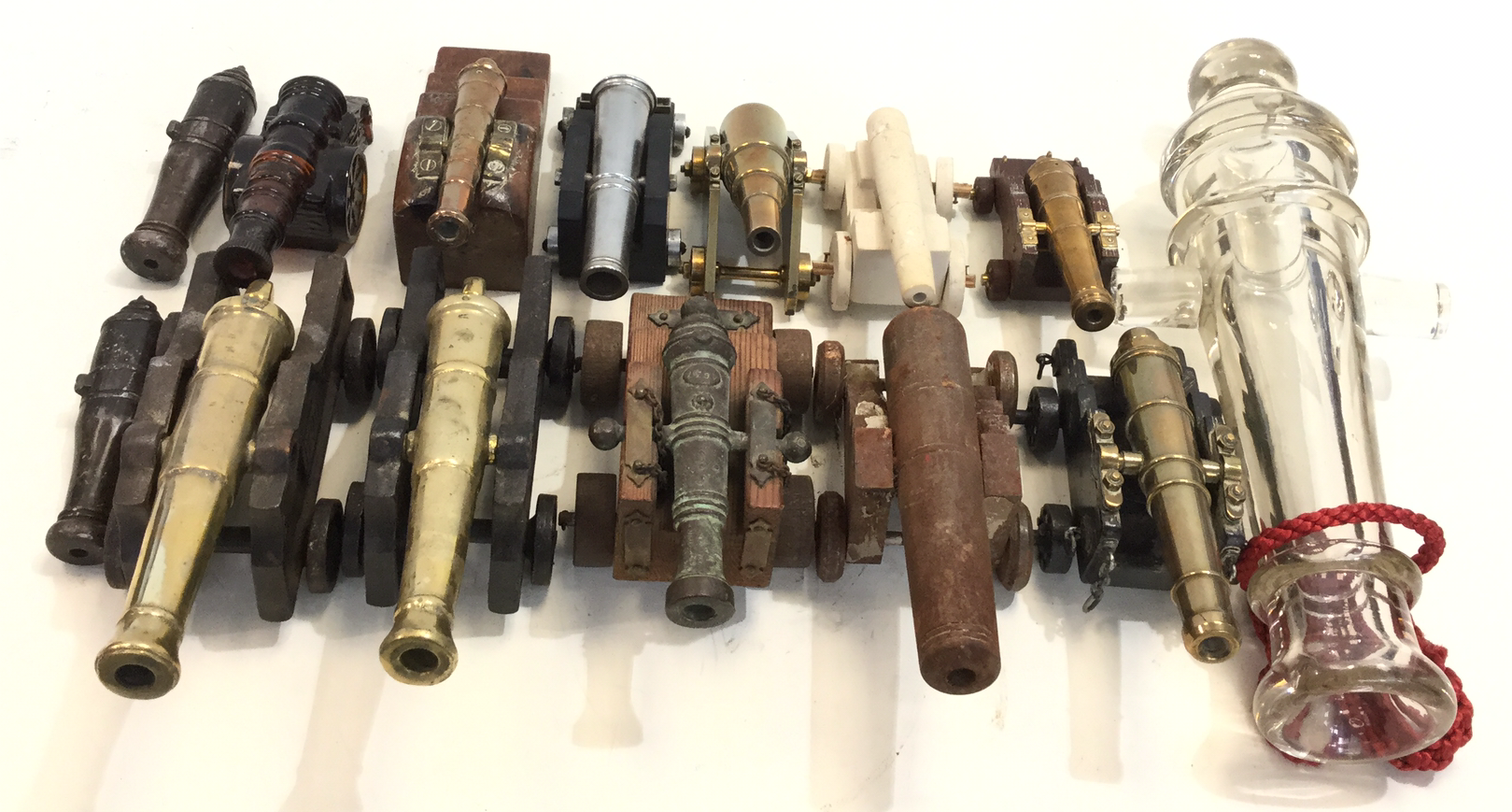 A collection of approx 20 model Ship's cannons in brass or bronze. Also ...