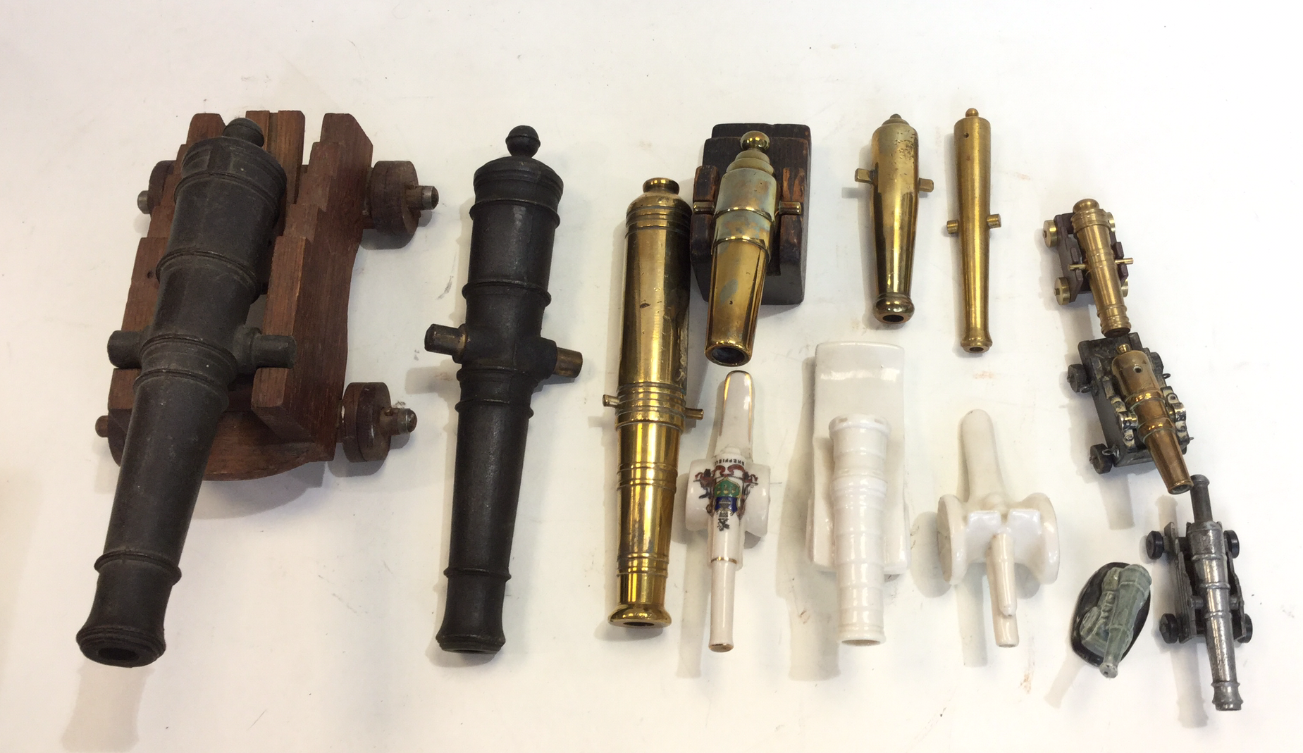 A collection of approx 20 model Ship's cannons in brass or bronze. Also ...