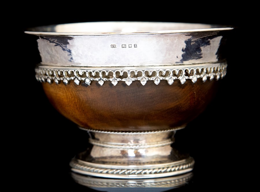 Omar Ramsden; A George V Arts and Crafts Sterling silver mounted mazer ...