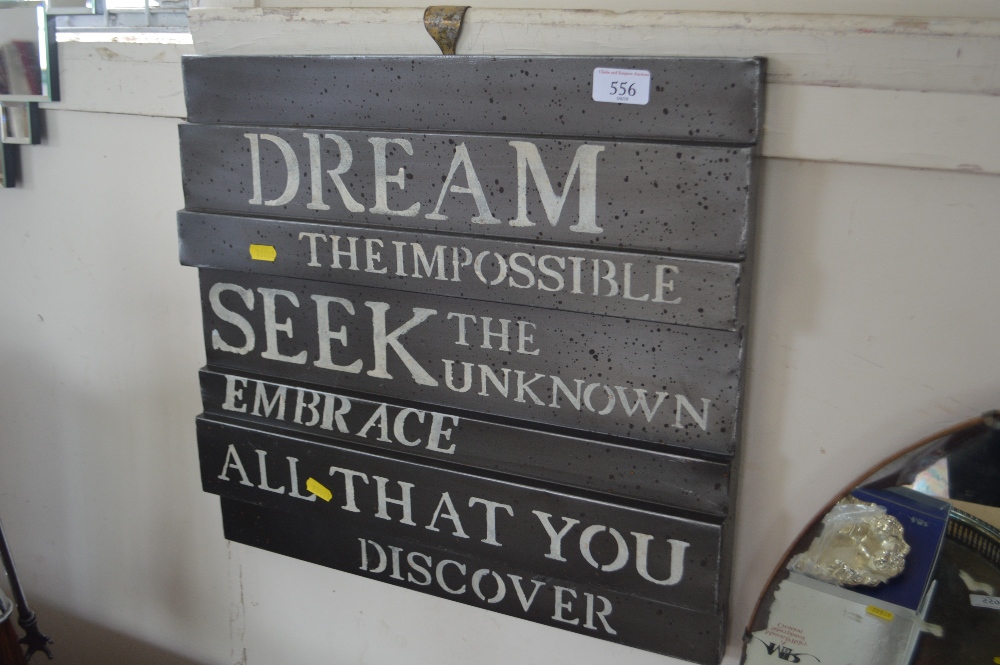 A metal slogan sign