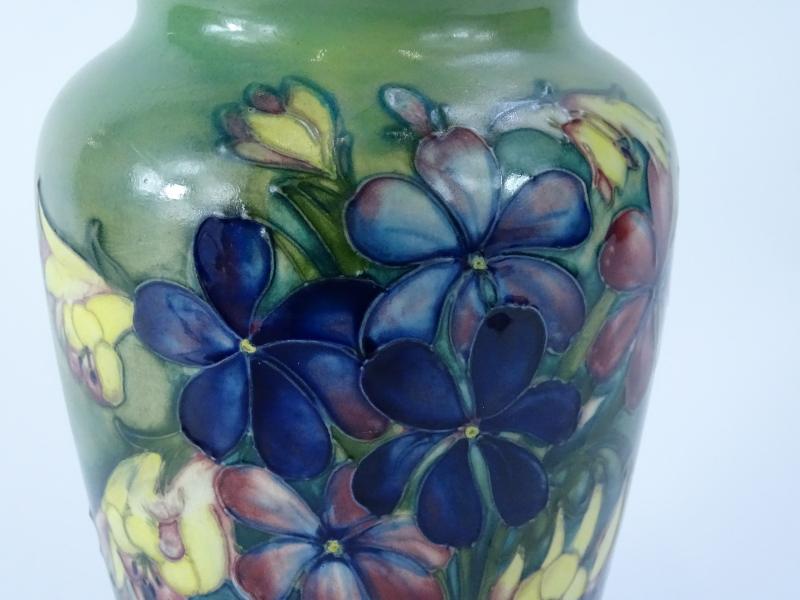 A Moorcroft pottery Spring Flowers pattern vase, decorated with flowers ...