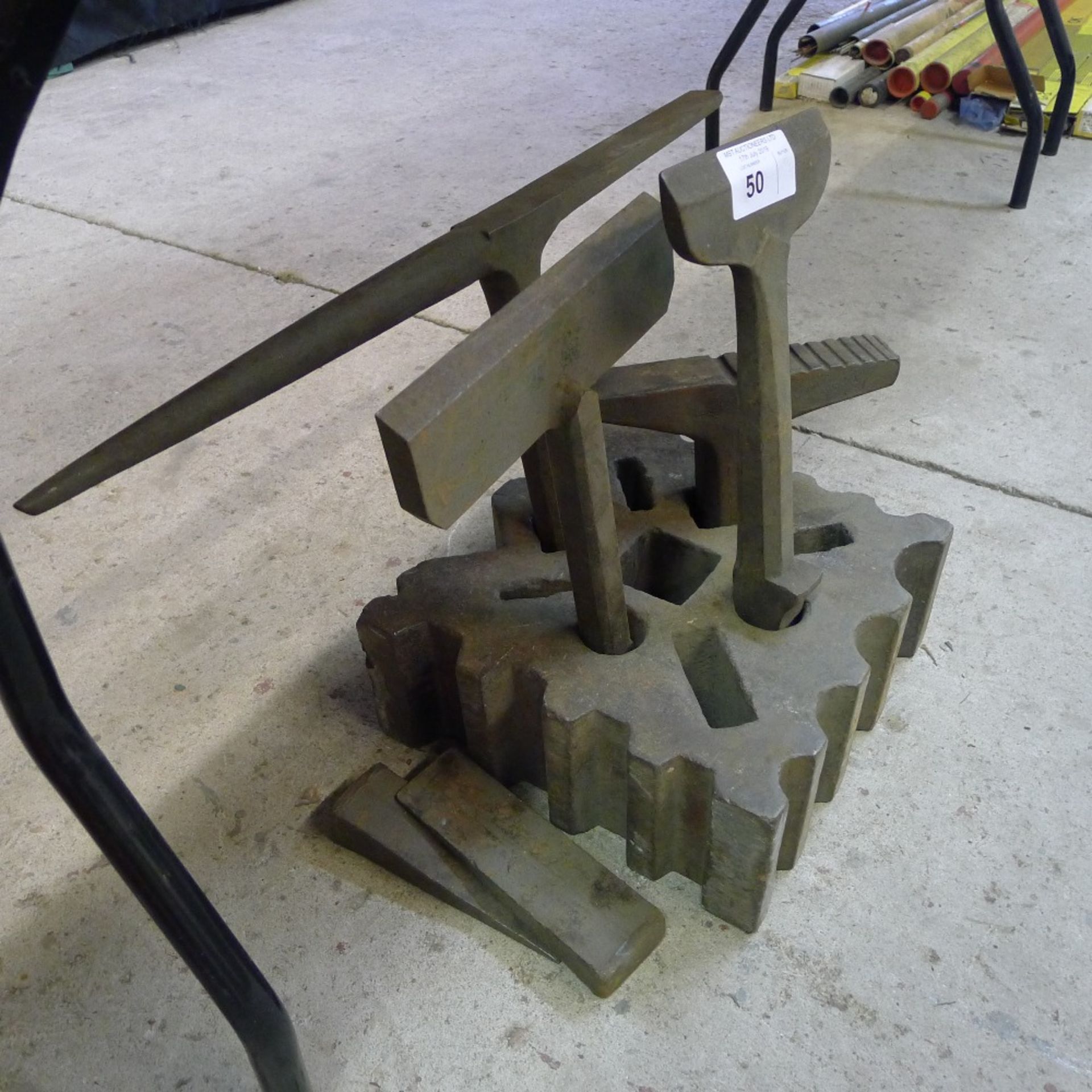 1 Blacksmiths swage block, 4 swage type tools and 2 wedges